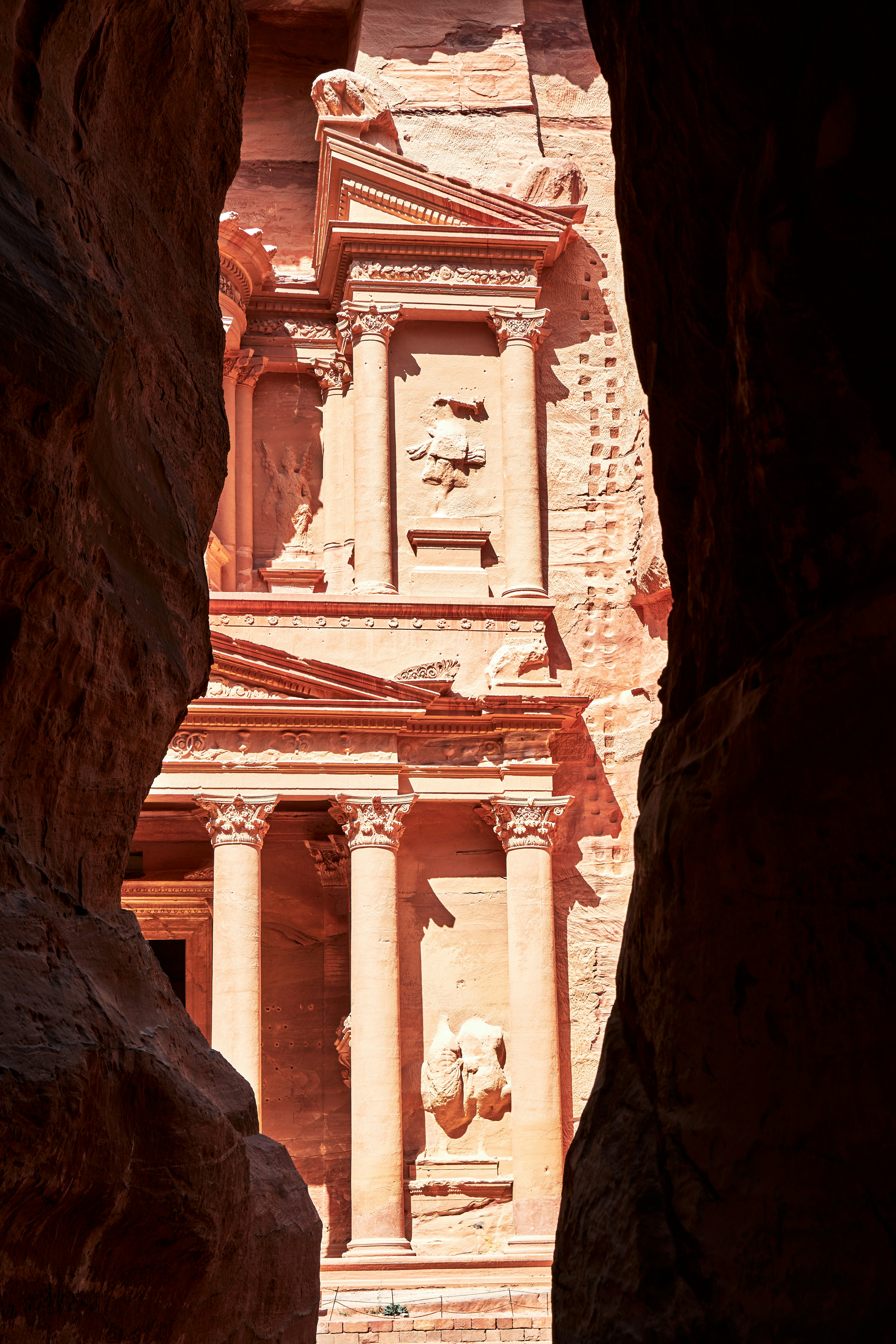 A building carved into the side of a cliff photo – Free Petra Image on ...