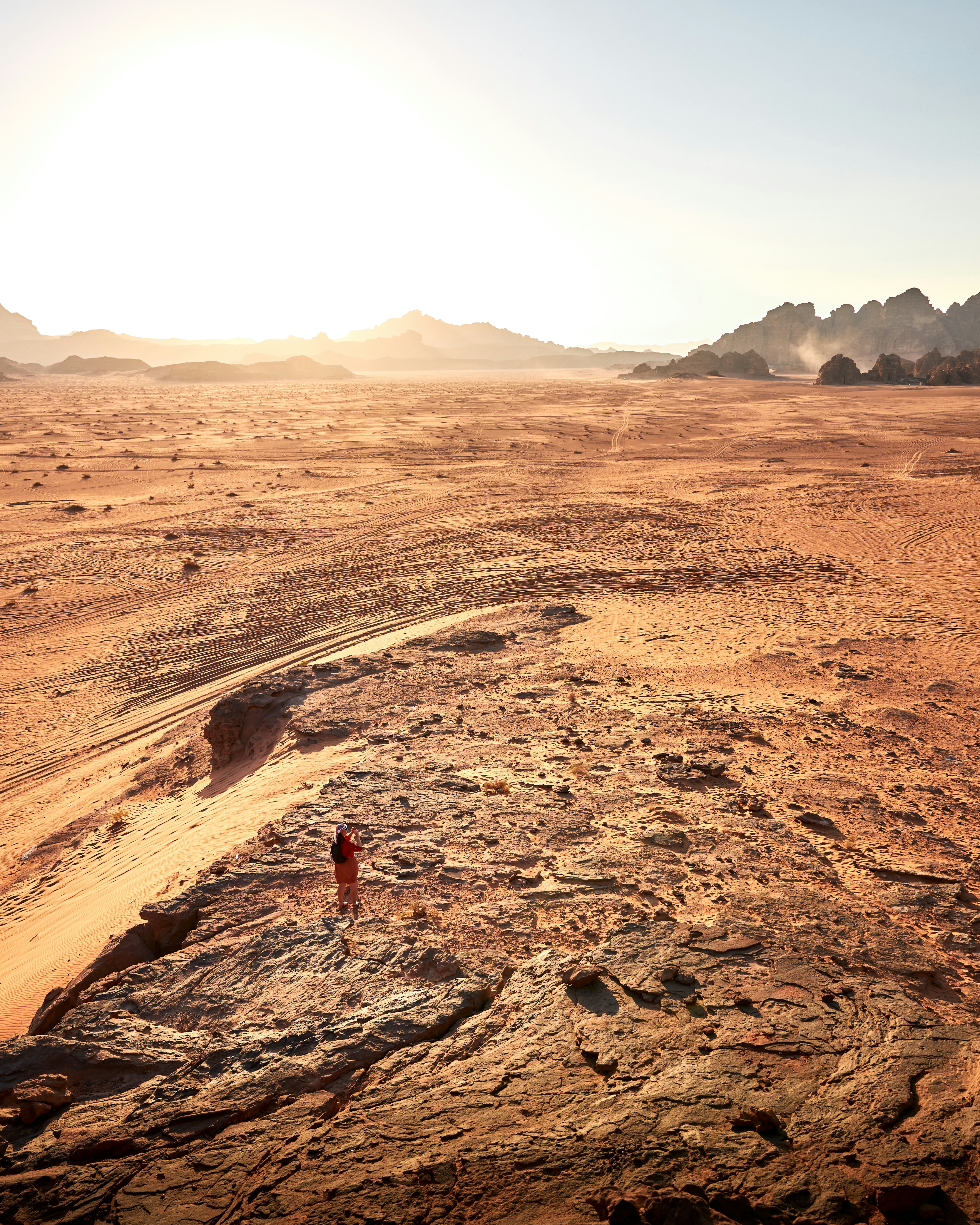 A person standing in the middle of a desert photo – Free Land Image on ...
