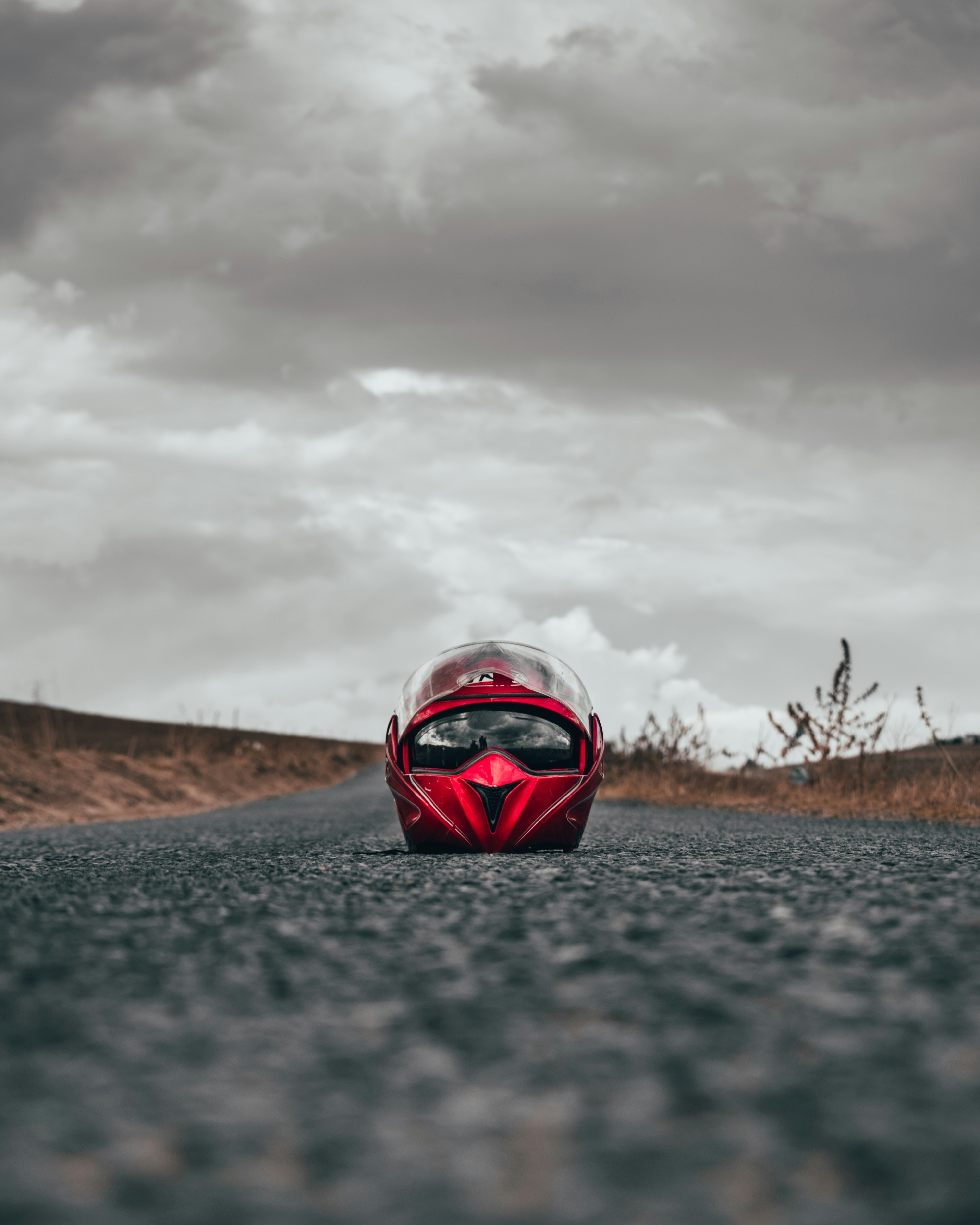 Red Helmet on the Road: a Ground-Level Moment of Stillness