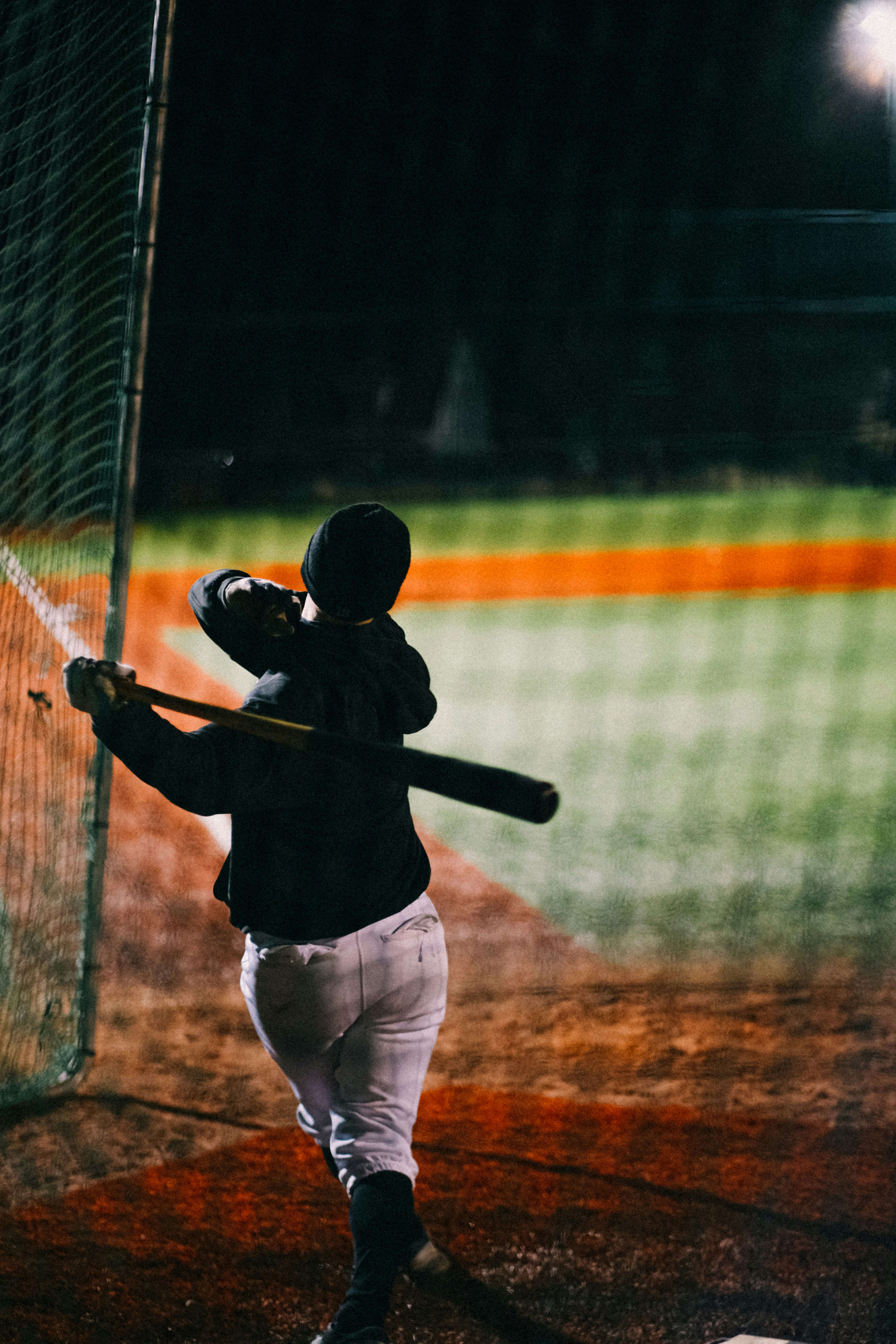 A baseball player swinging a bat at a ball photo – Free Human Image on ...