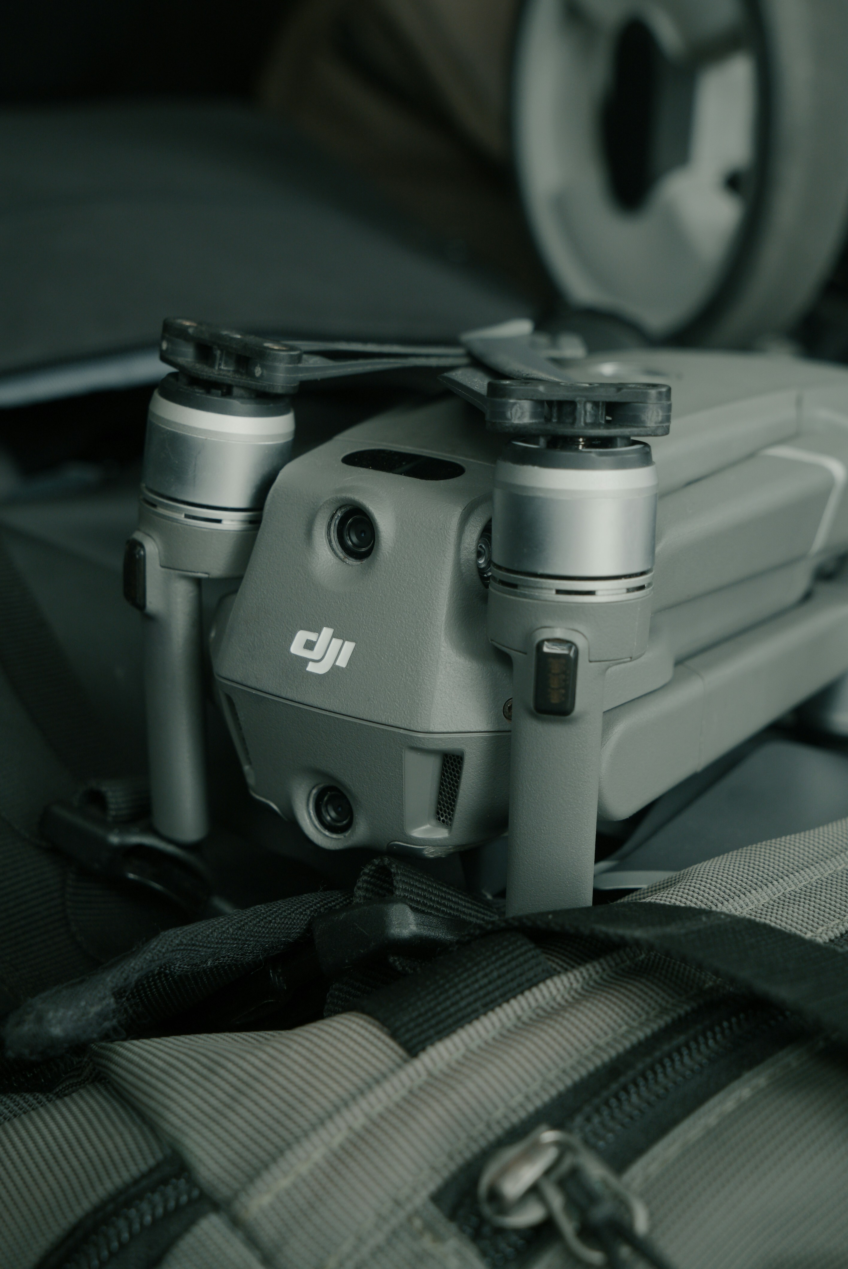 Dji drone quadcopter on travel pack ready for takeoff