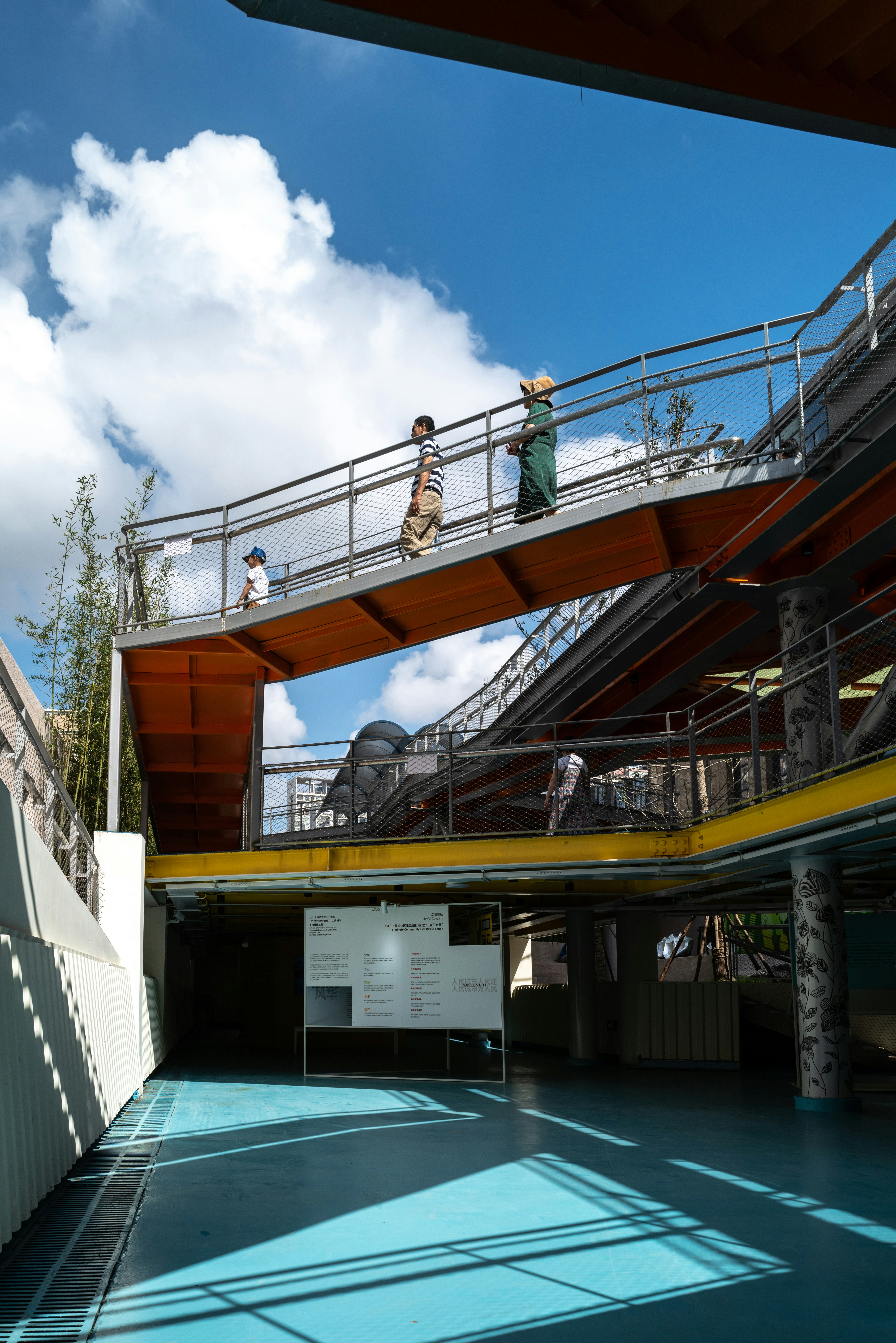 Rising Walkway: Struts, Shadows, and Sky