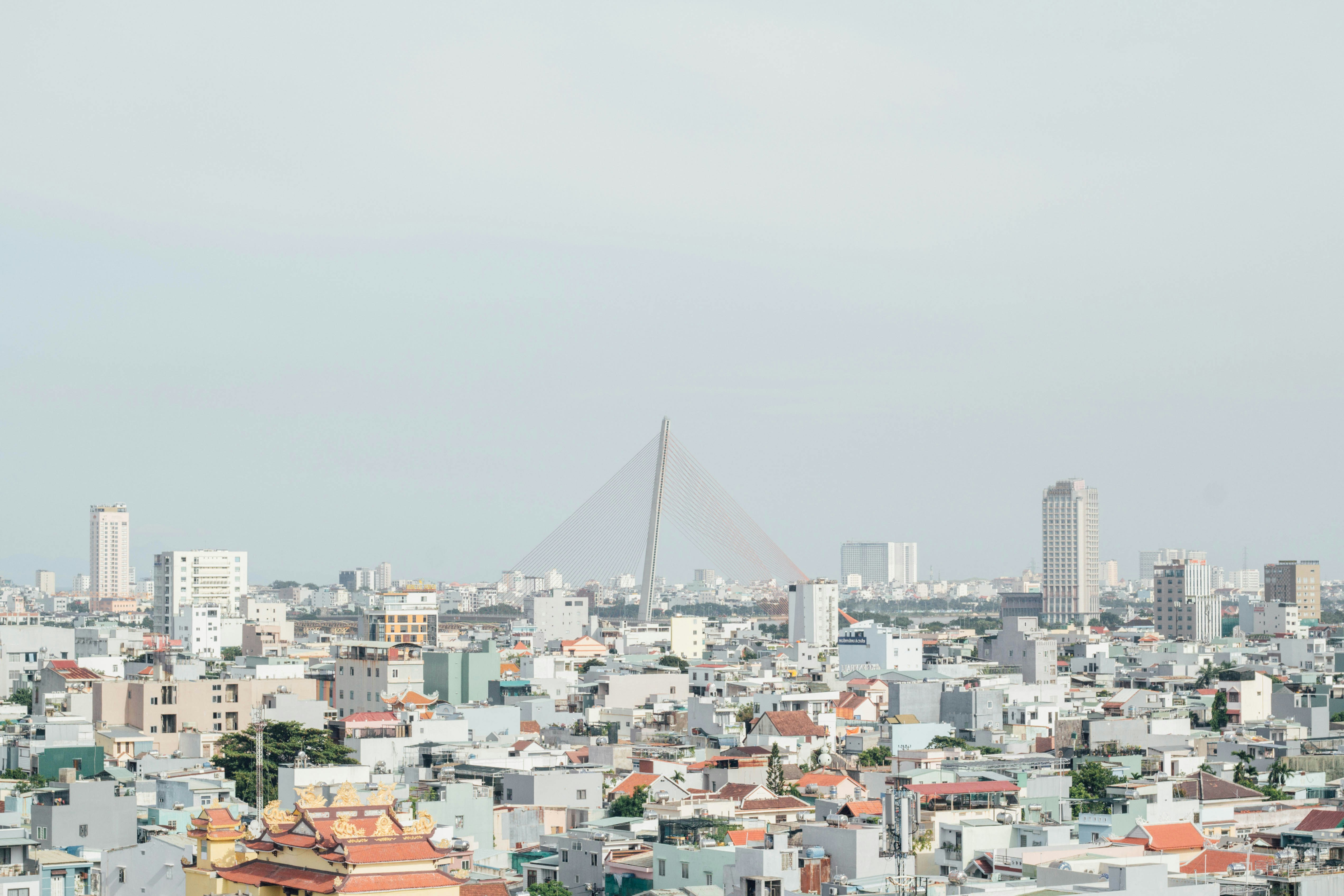 Cable-Stayed Skyline: A Quiet Cityscape with a Distant Bridge