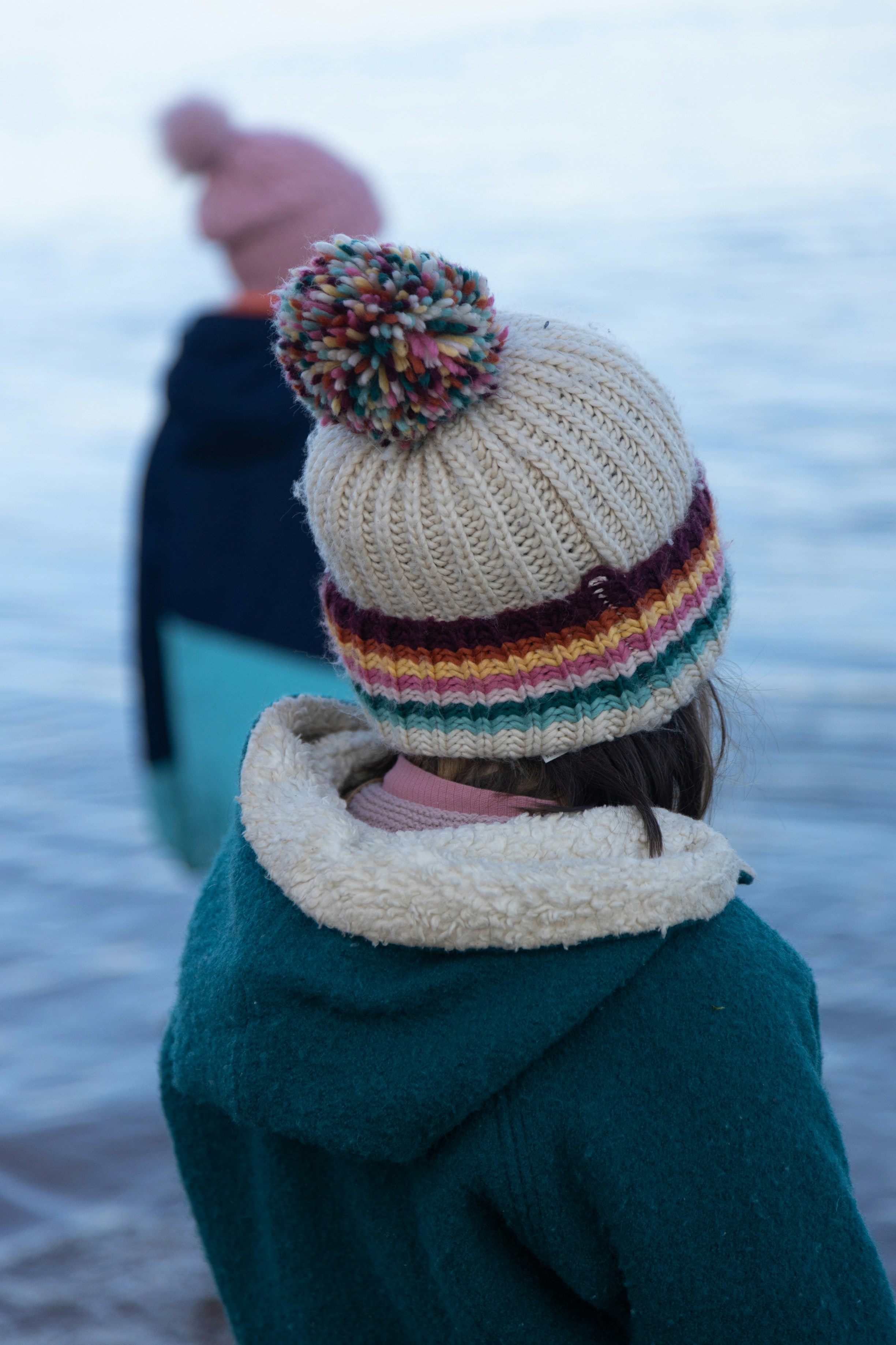 Two Winter Hats by the Water: A Quiet Portrait of Cozy Color