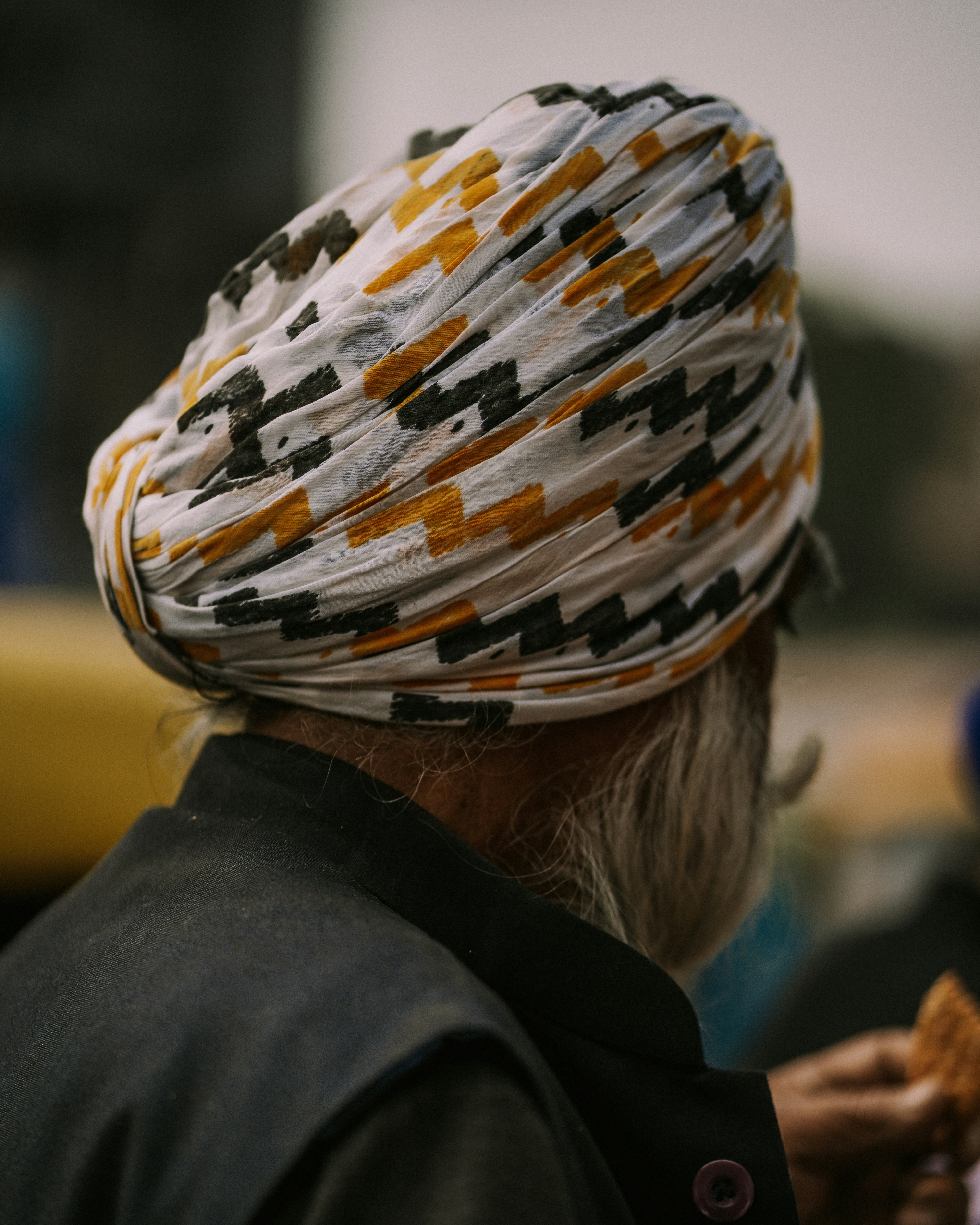 A man with a white turban eating a piece of food photo – Free Human ...