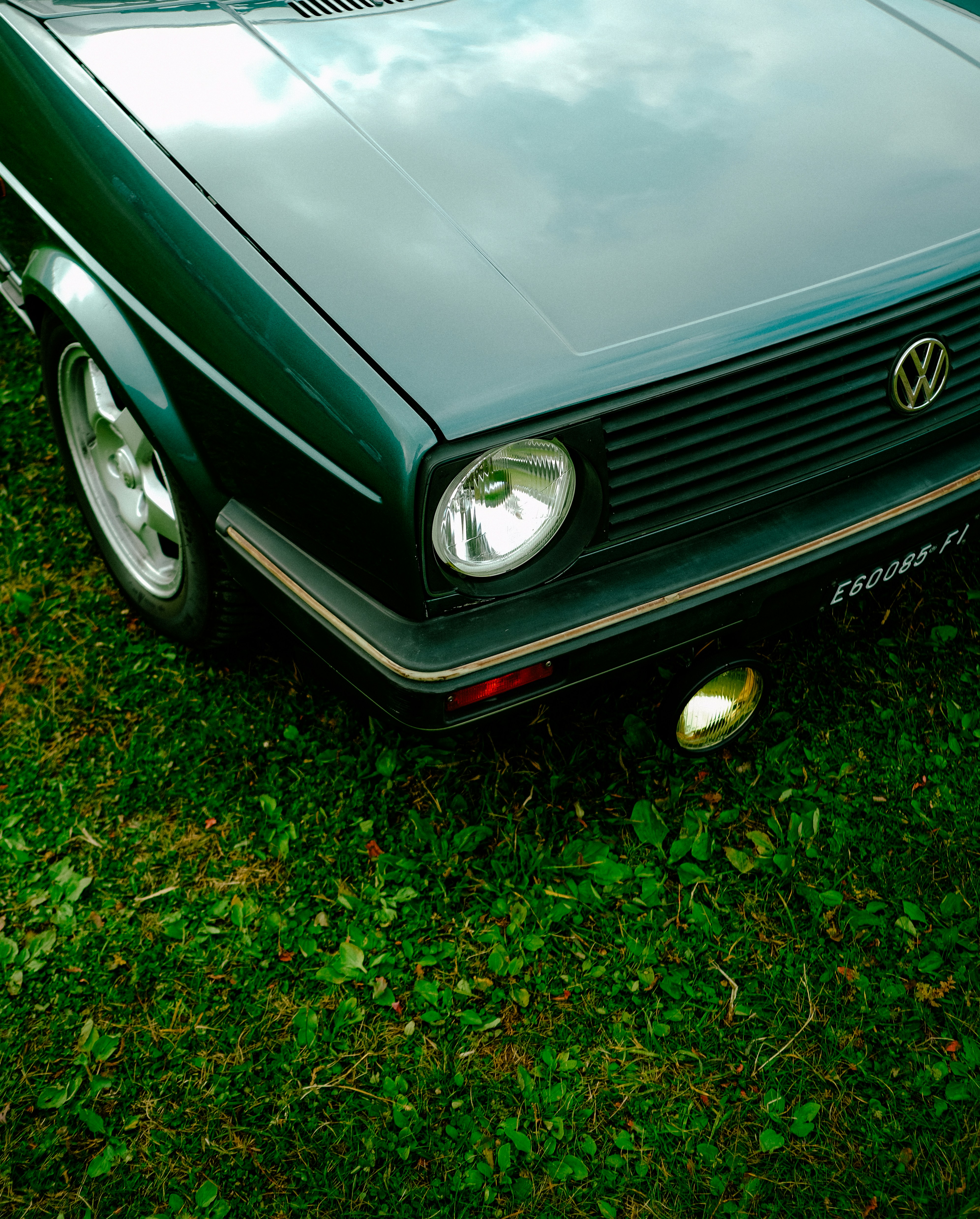 Verdant Vintage: Front-Quarter Volkswagen in Quiet Grass