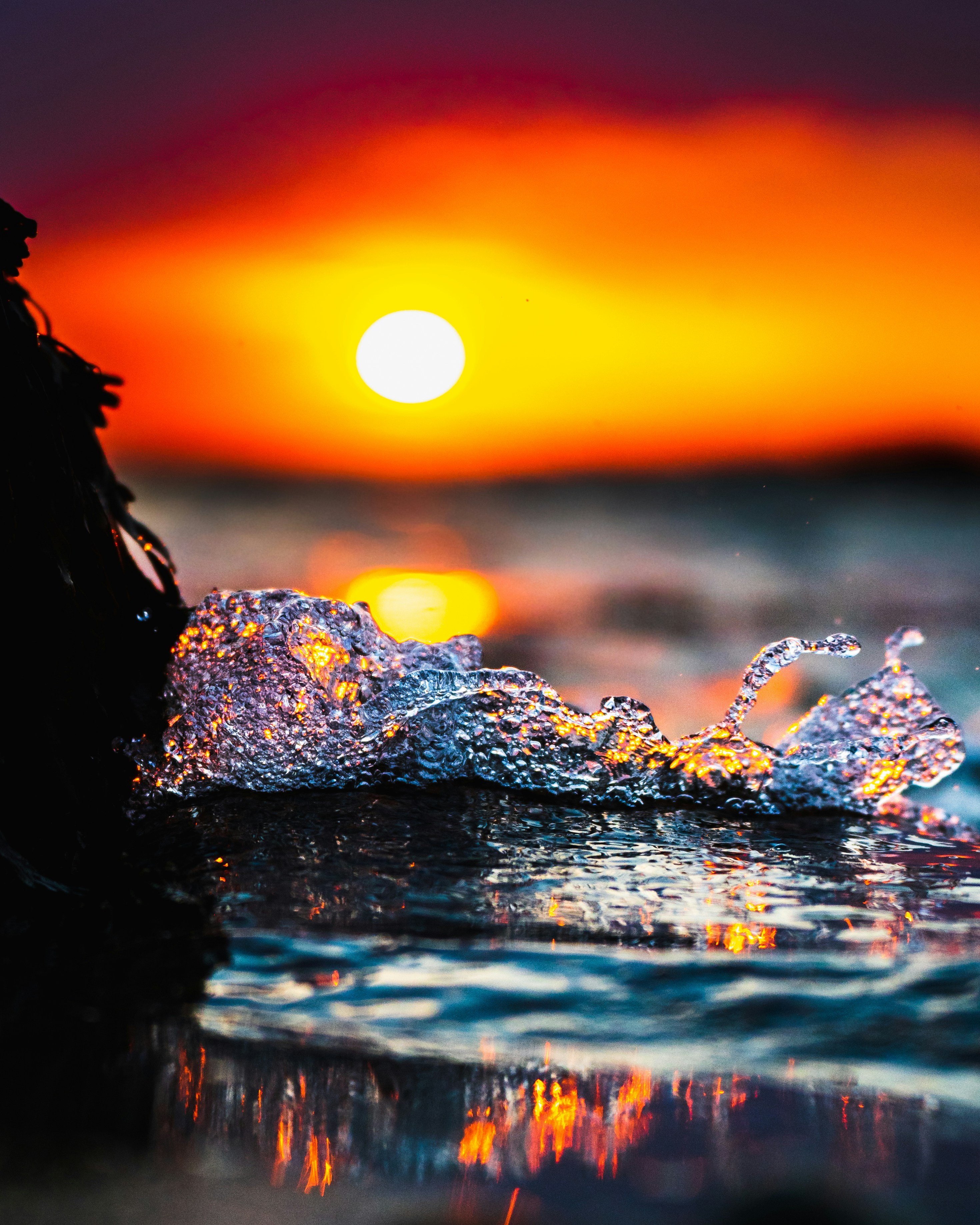 A close up of water with a sunset in the background photo – Free Ocean ...