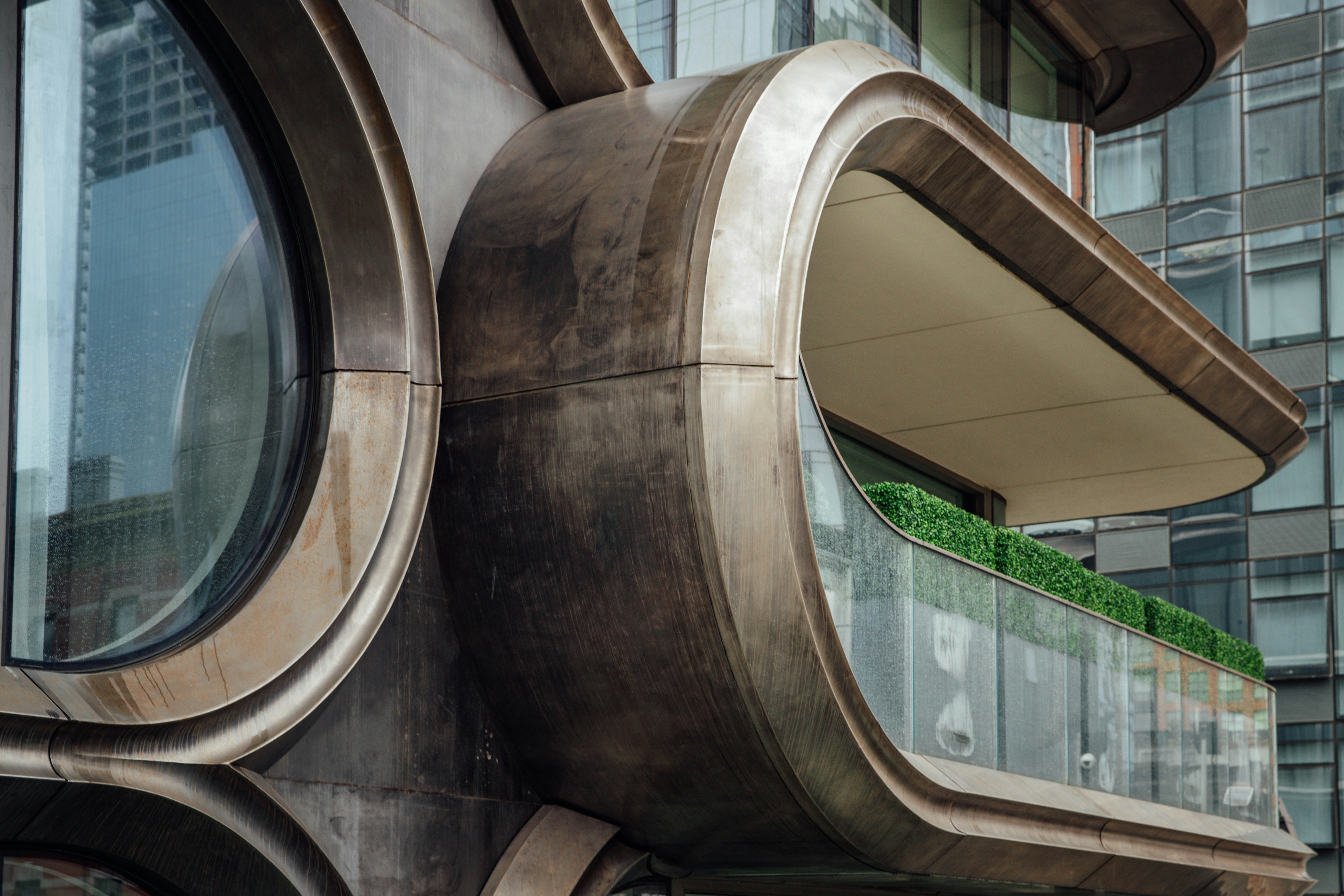 Orbiting Metal: Close-Up on a Modern Building's Curved Facades