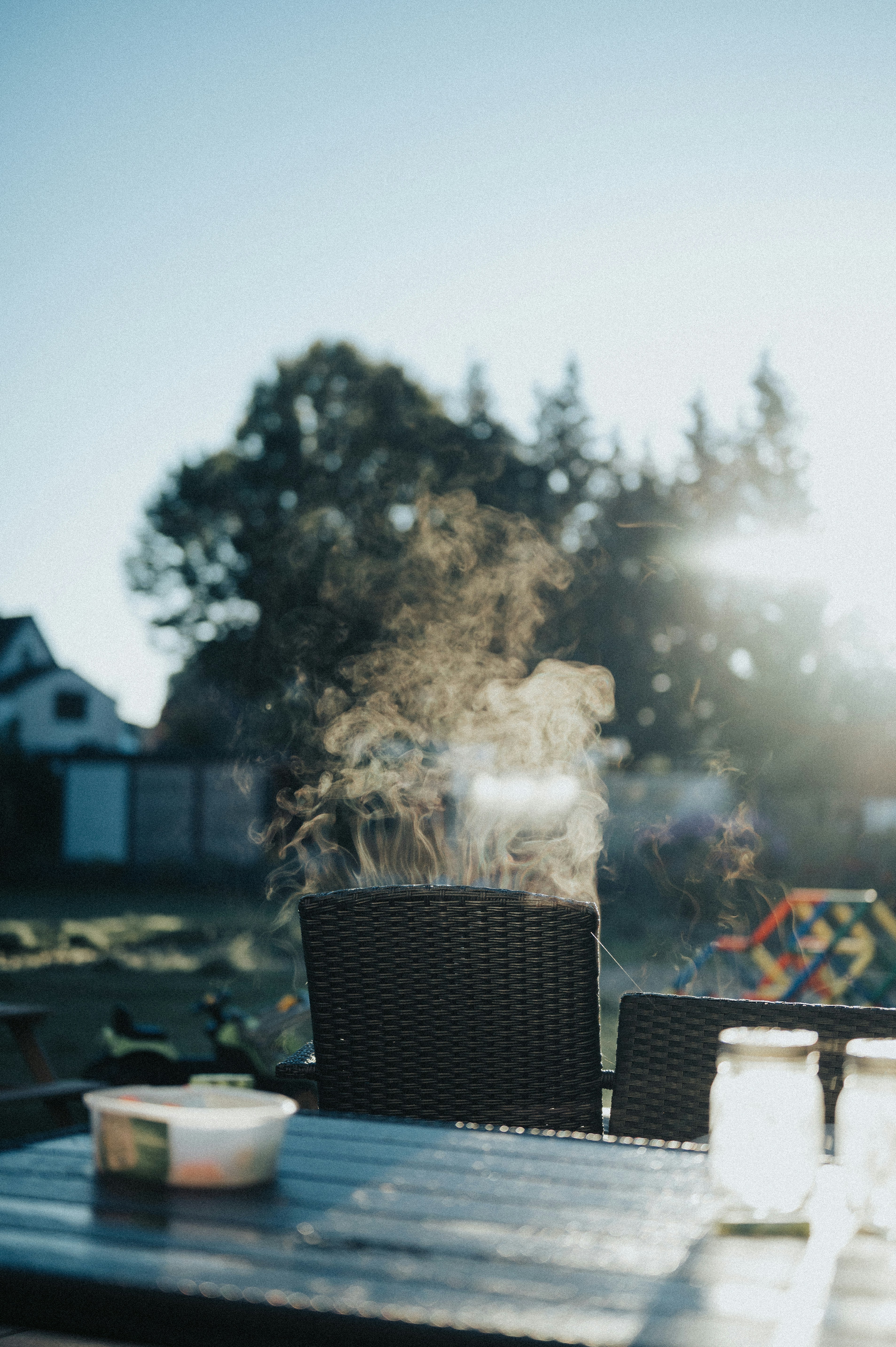 Sunlit Steam on a Wicker Table: Backyard Quiet in Golden Hour
