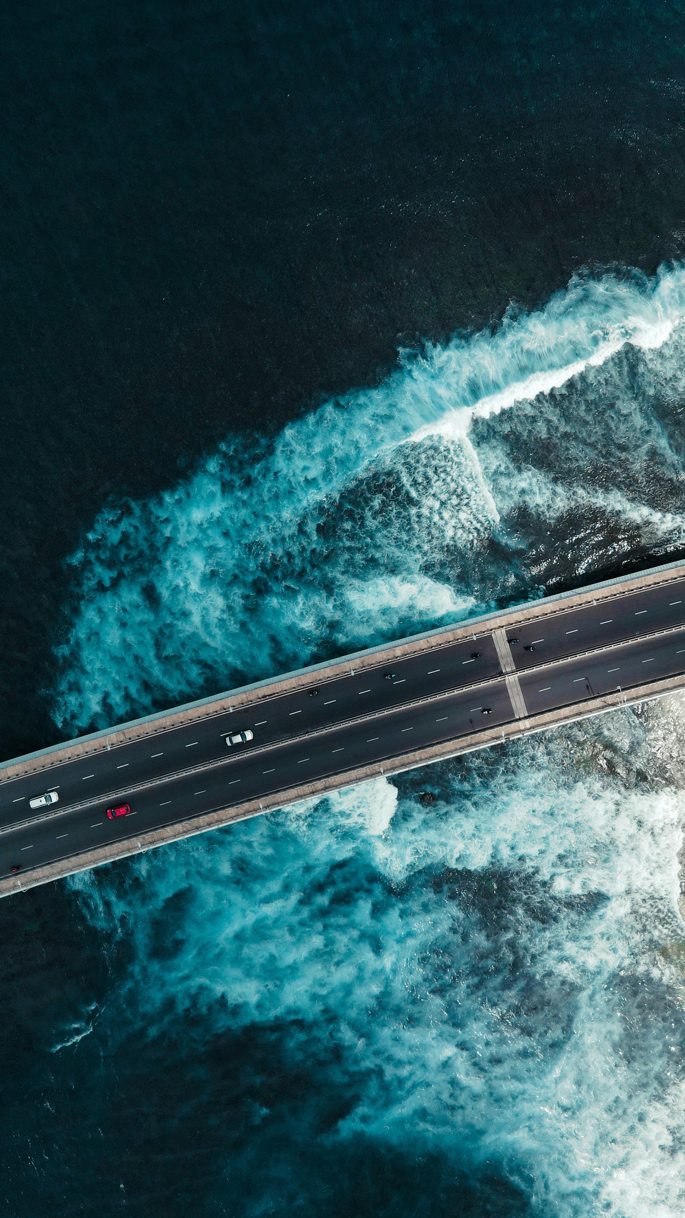 An aerial view of a bridge over a body of water photo – Free Ocean ...