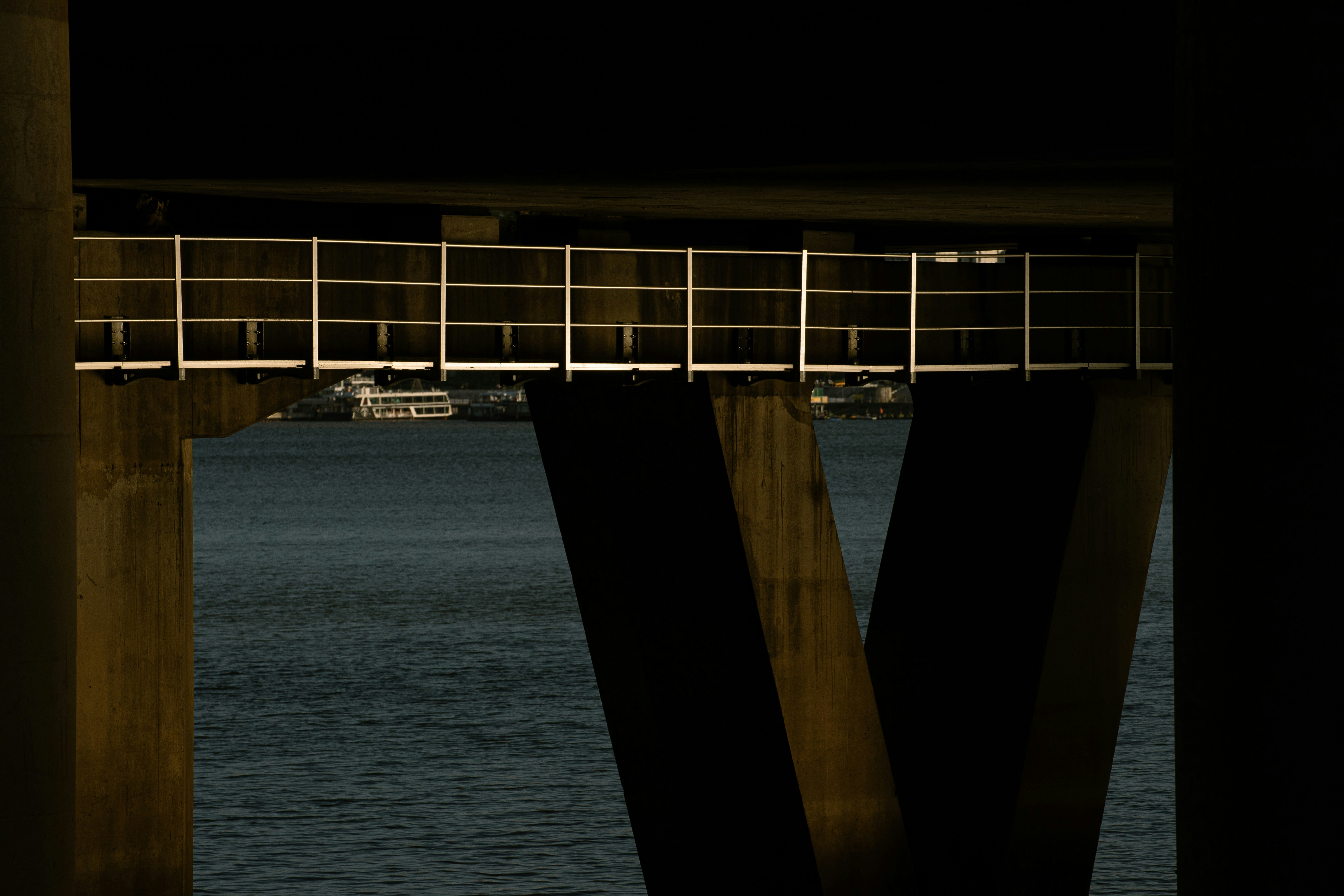 Under the Pier: Silent Lakelike Structure Framing the Quiet Sea
