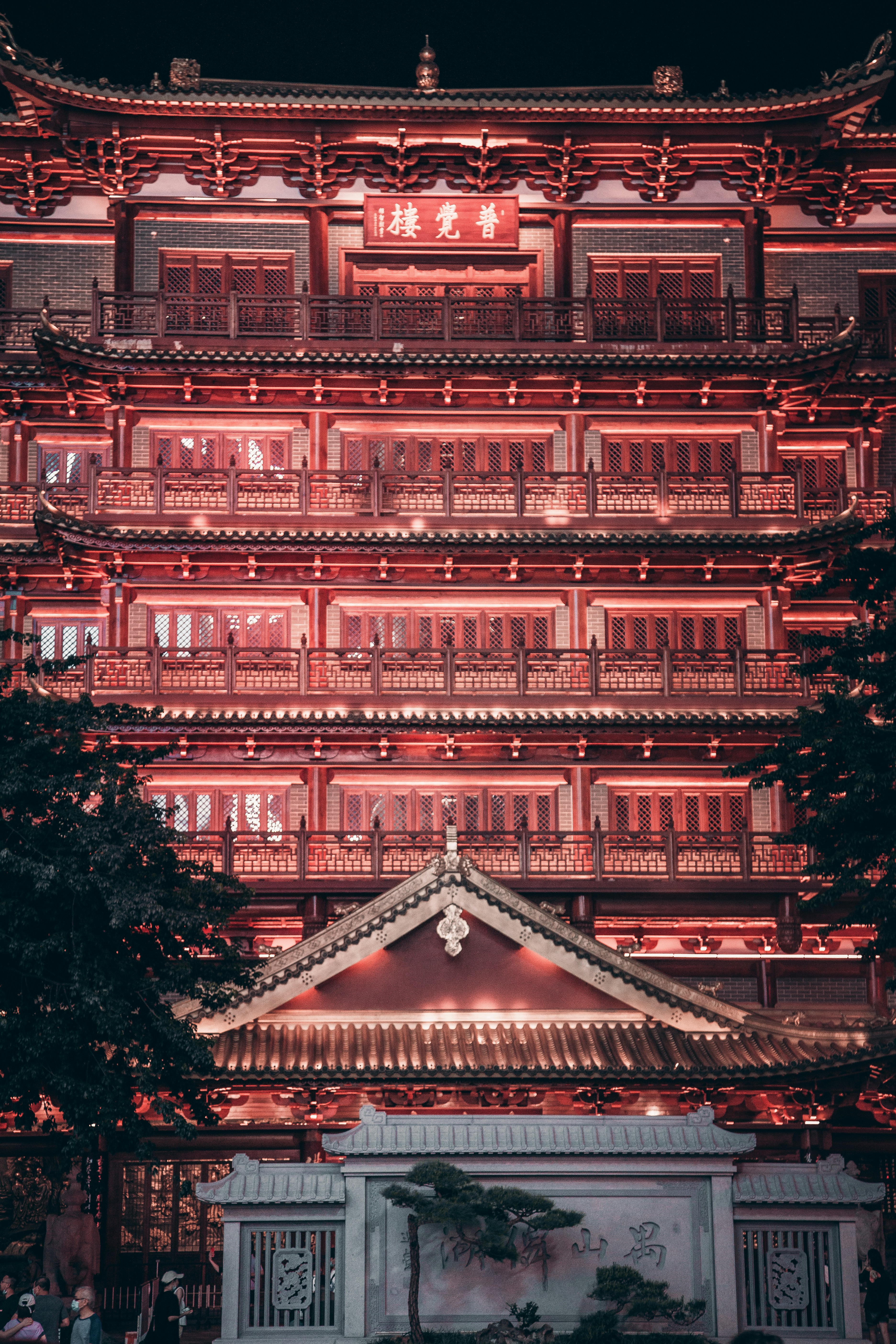 A tall building with red lights on top of it photo – Free Temple Image ...