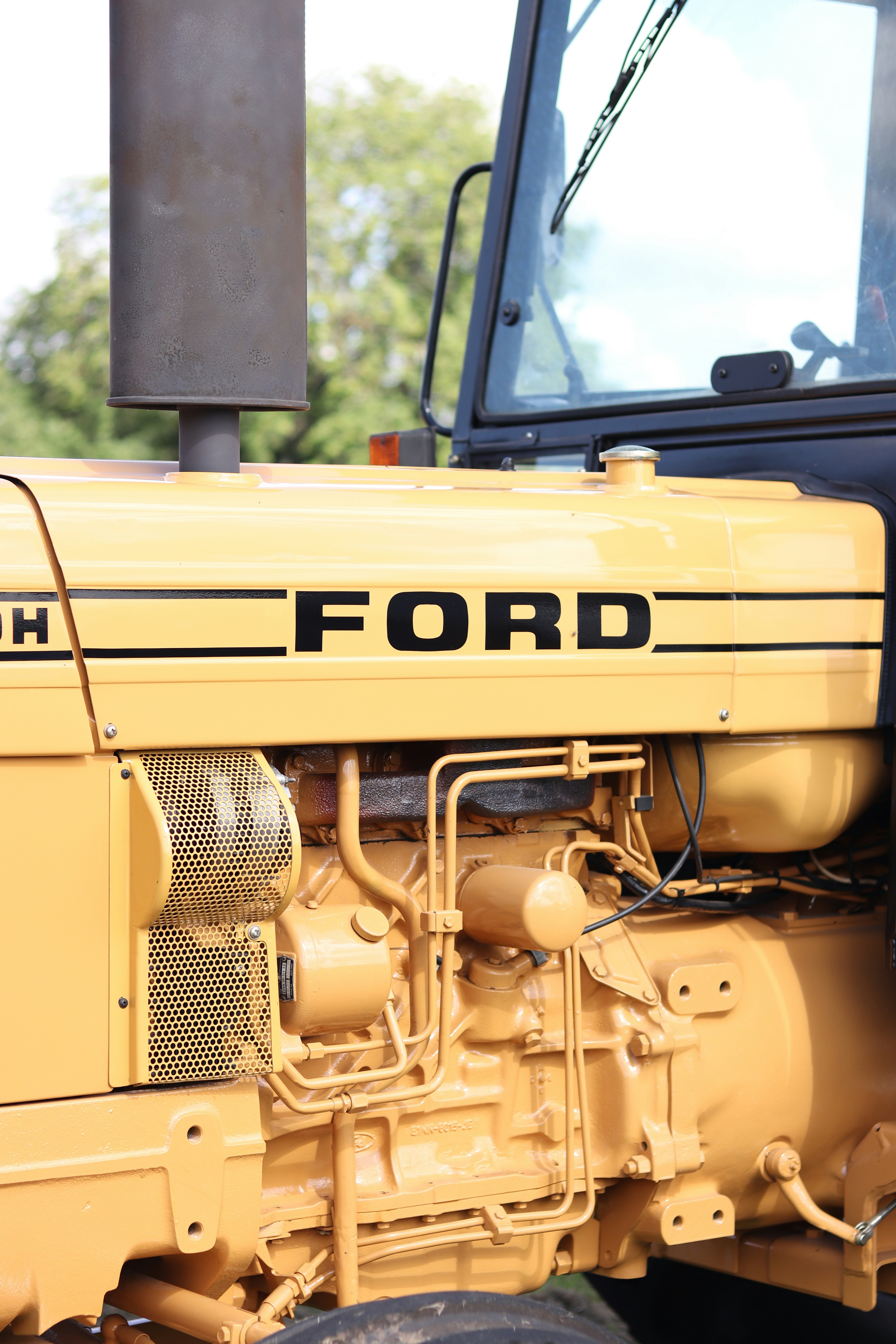 Yellow Ford Machinery: A Close View of the Engine Block and Logo
