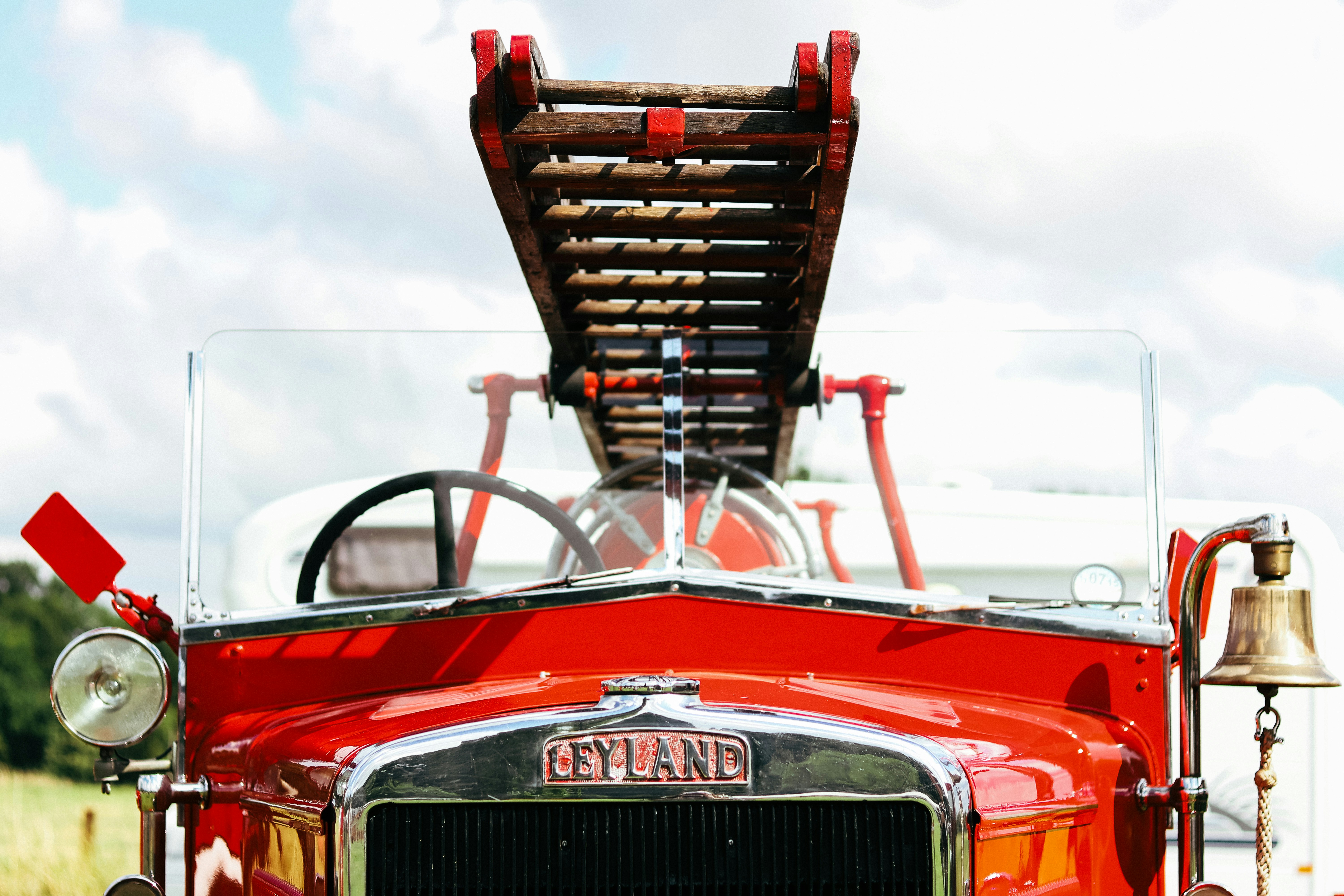 Crimson Front: Chrome Grille of a Vintage Fire Engine