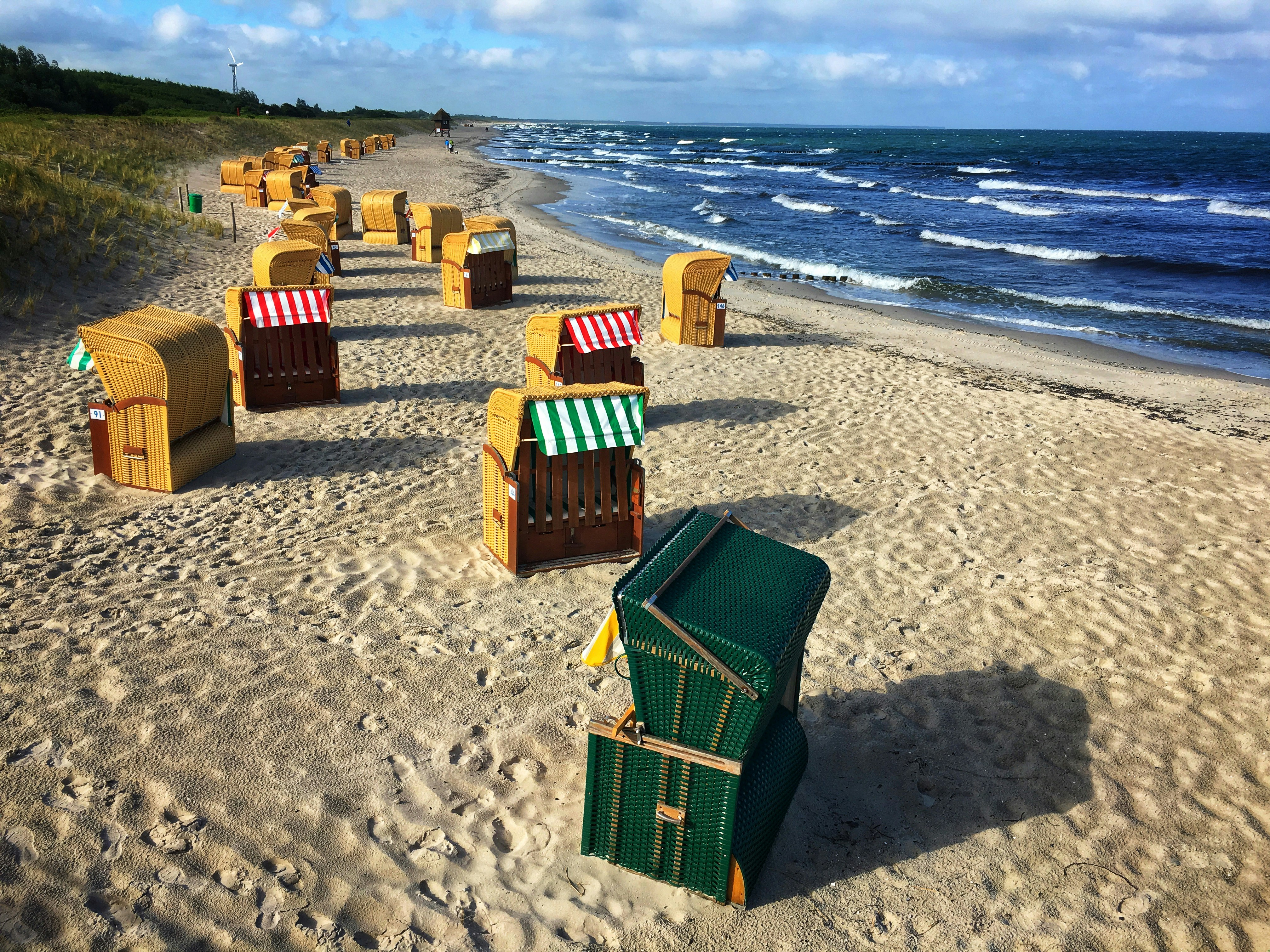 Colorful Beach Carts Line the Sandy Shore
