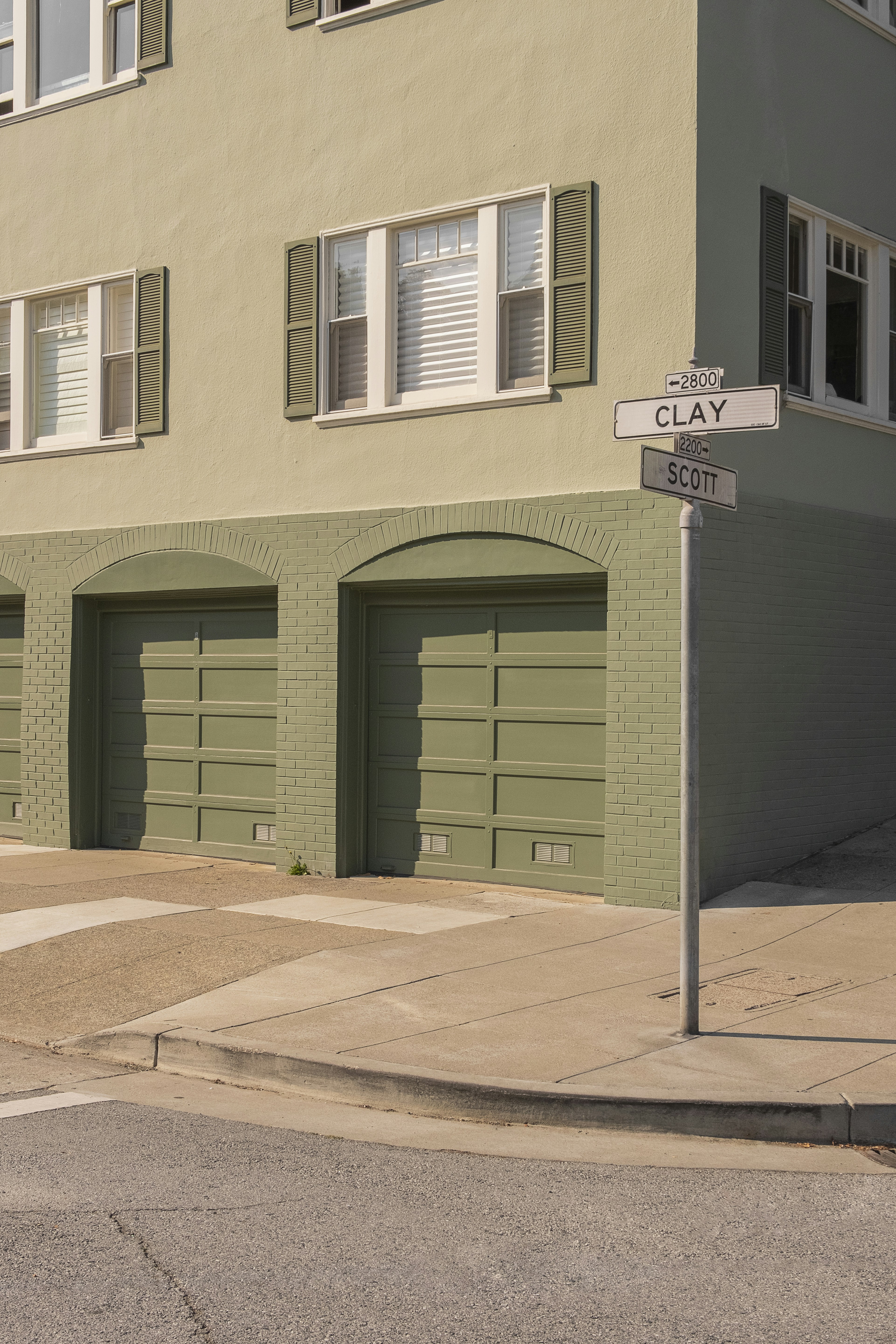 a street sign on a pole in front of a building