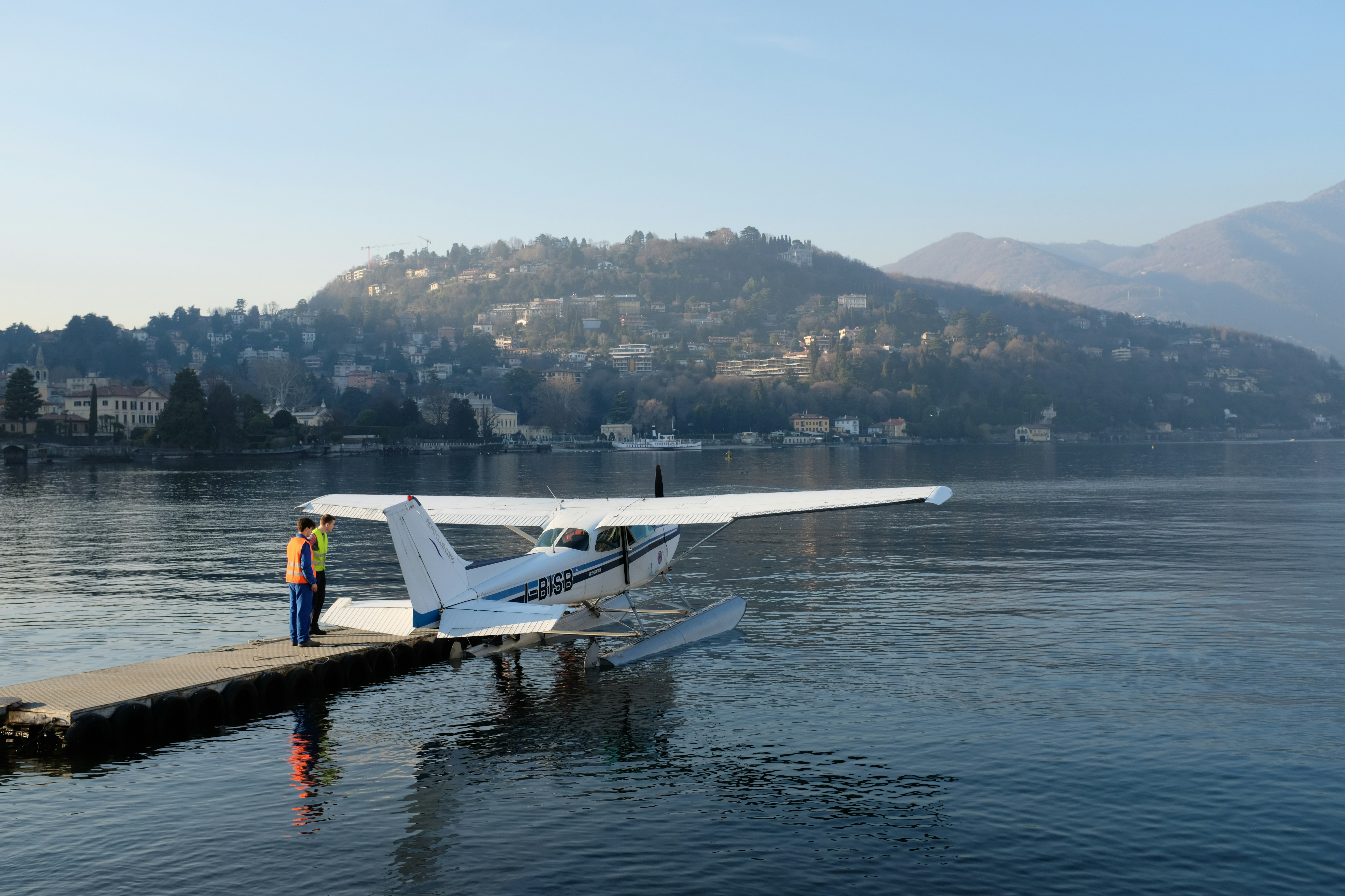 Floating Quiet: Small Plane at a Serene Lake Dock