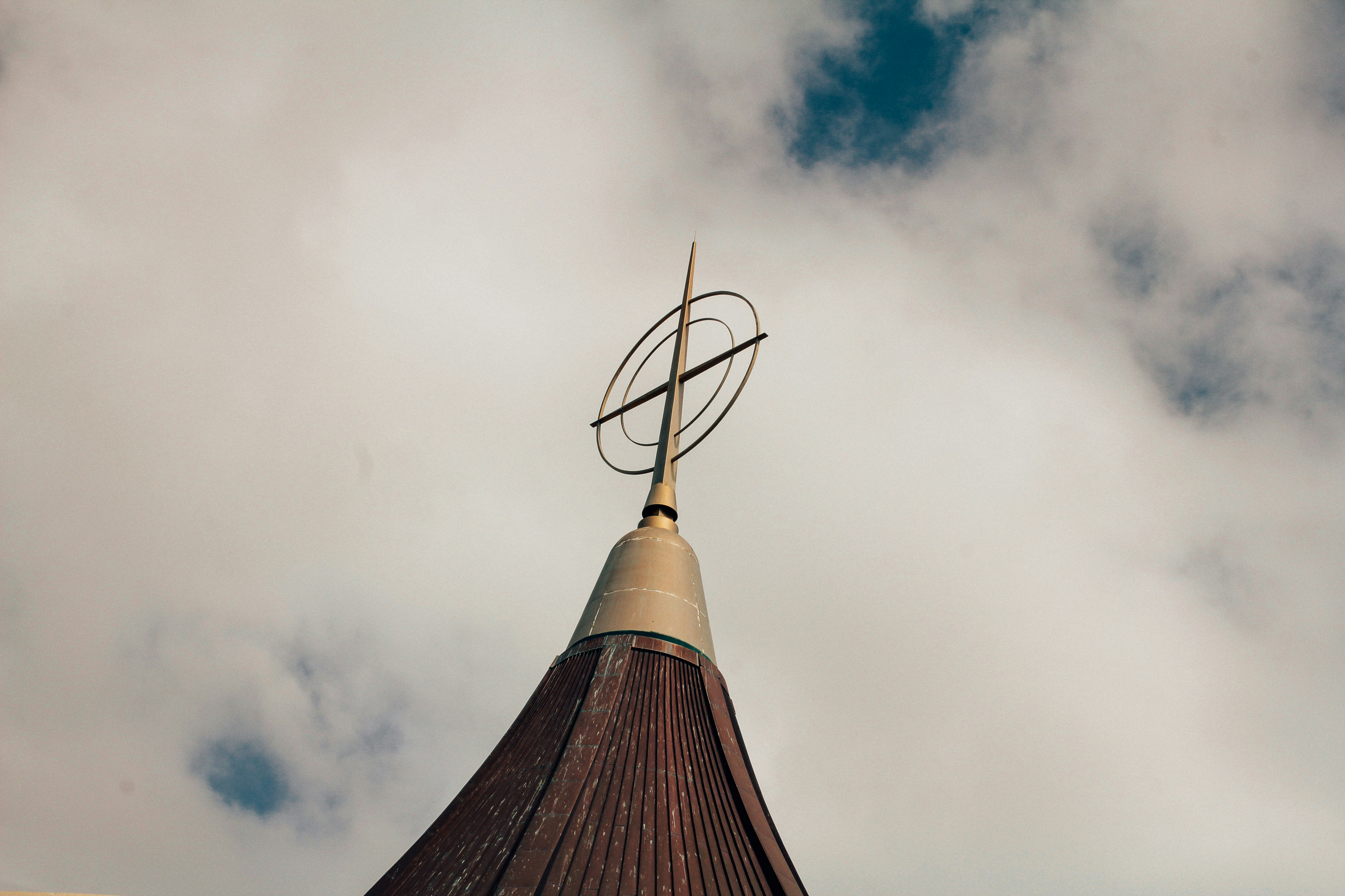 A tall building with a weather vane on top of it photo – Free Lute ...