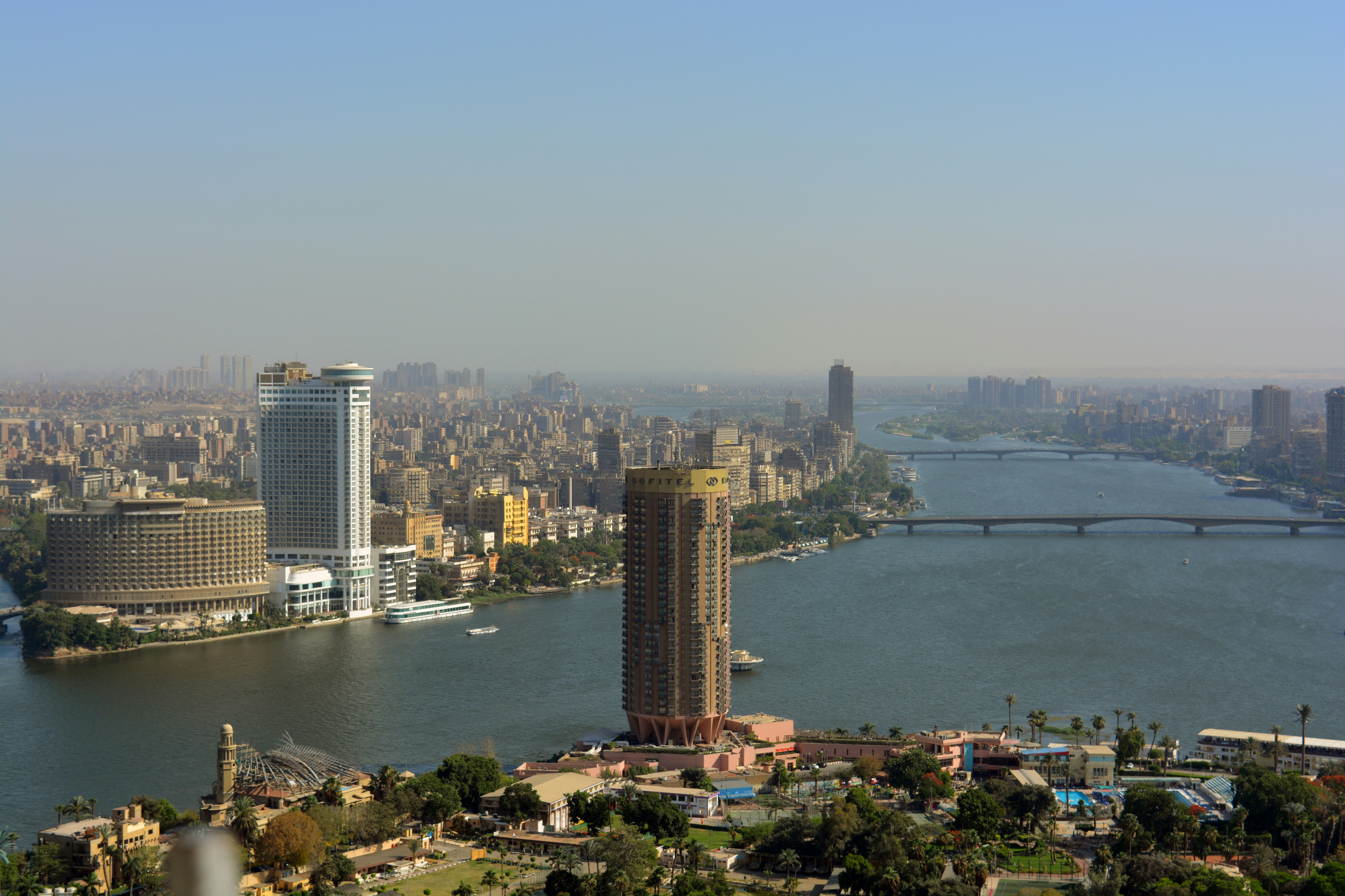 A view of a city with a river running through it photo – Free Building ...