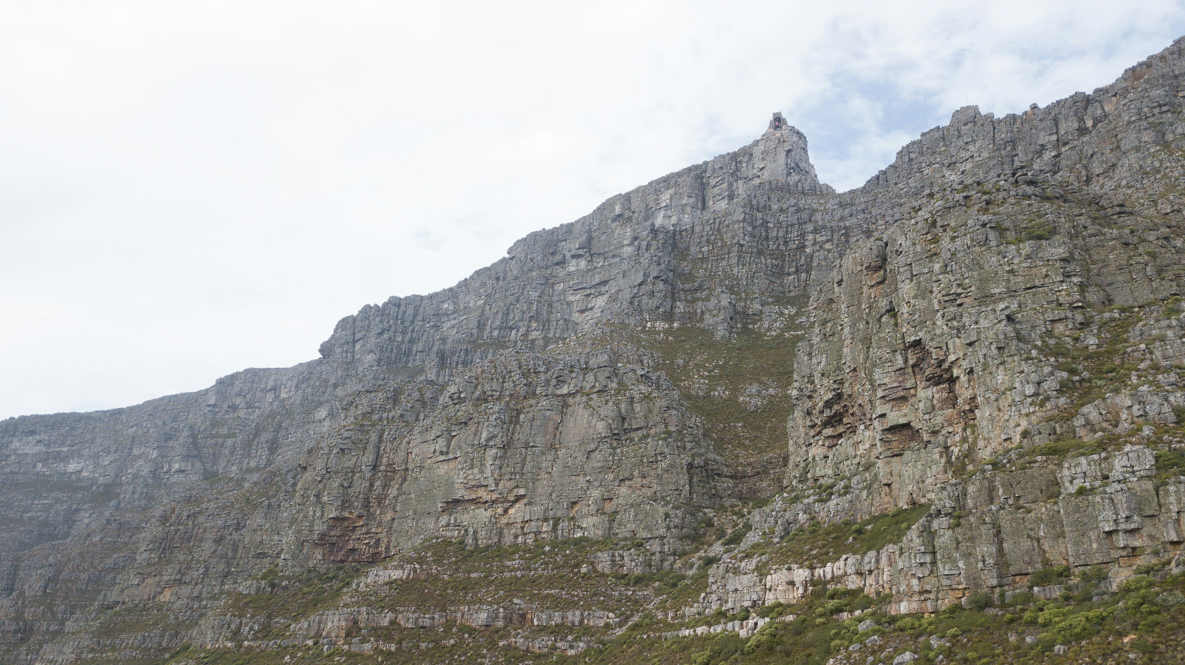 Strata Sentinel: Weathered Granite Cliffs Under a Quiet Sky