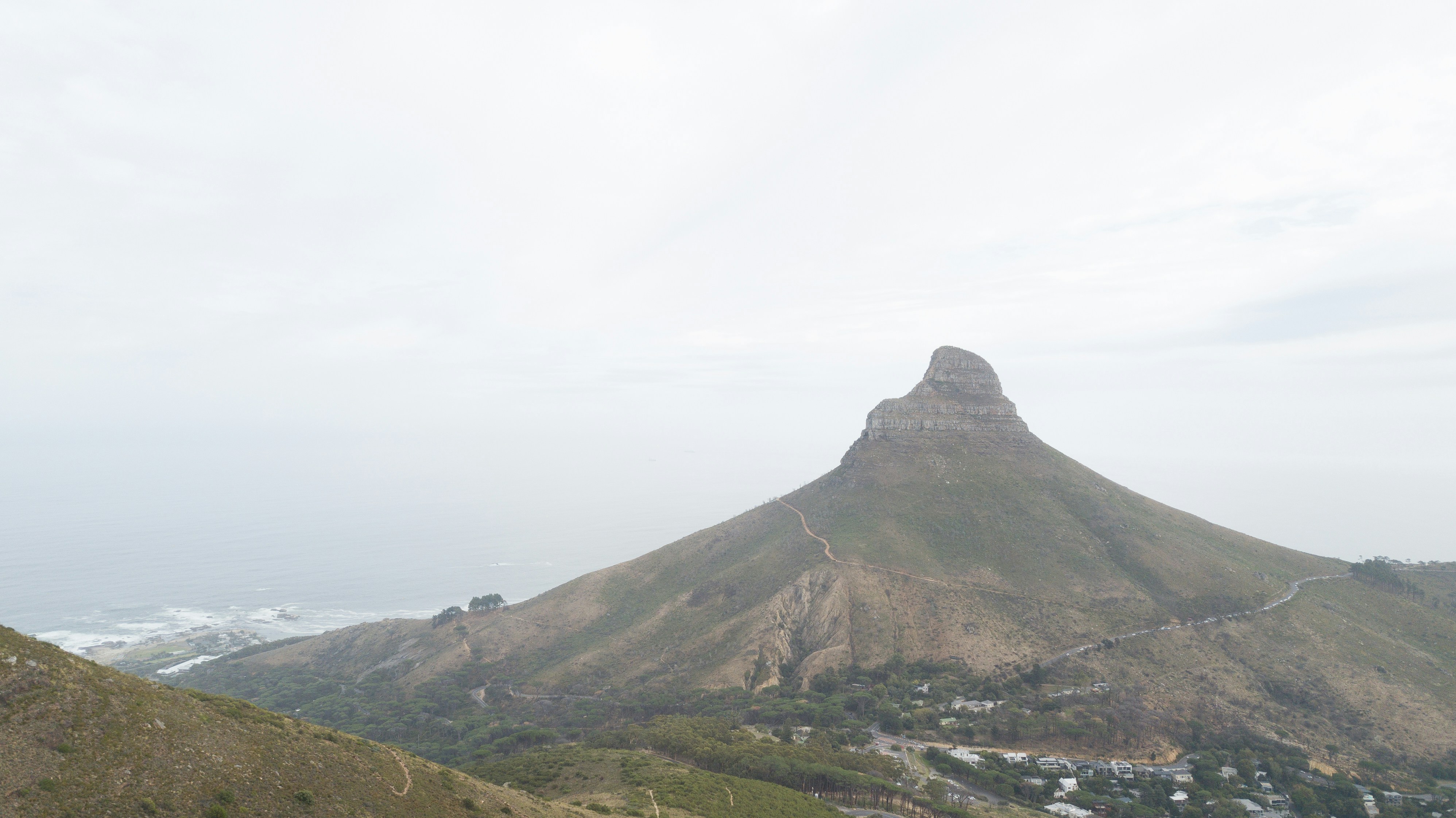 a view of a mountain with a road going through it