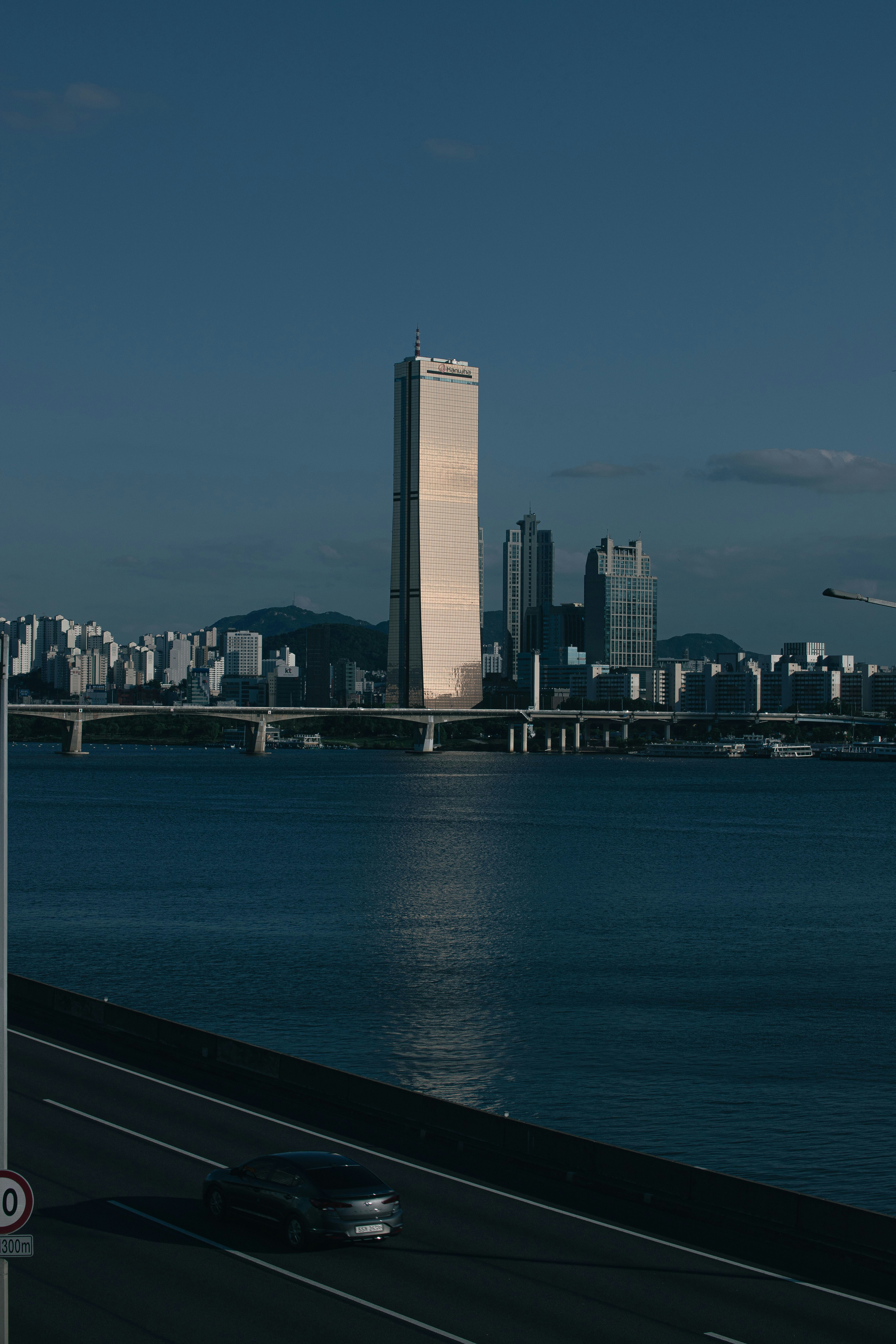 a large body of water with a city in the background