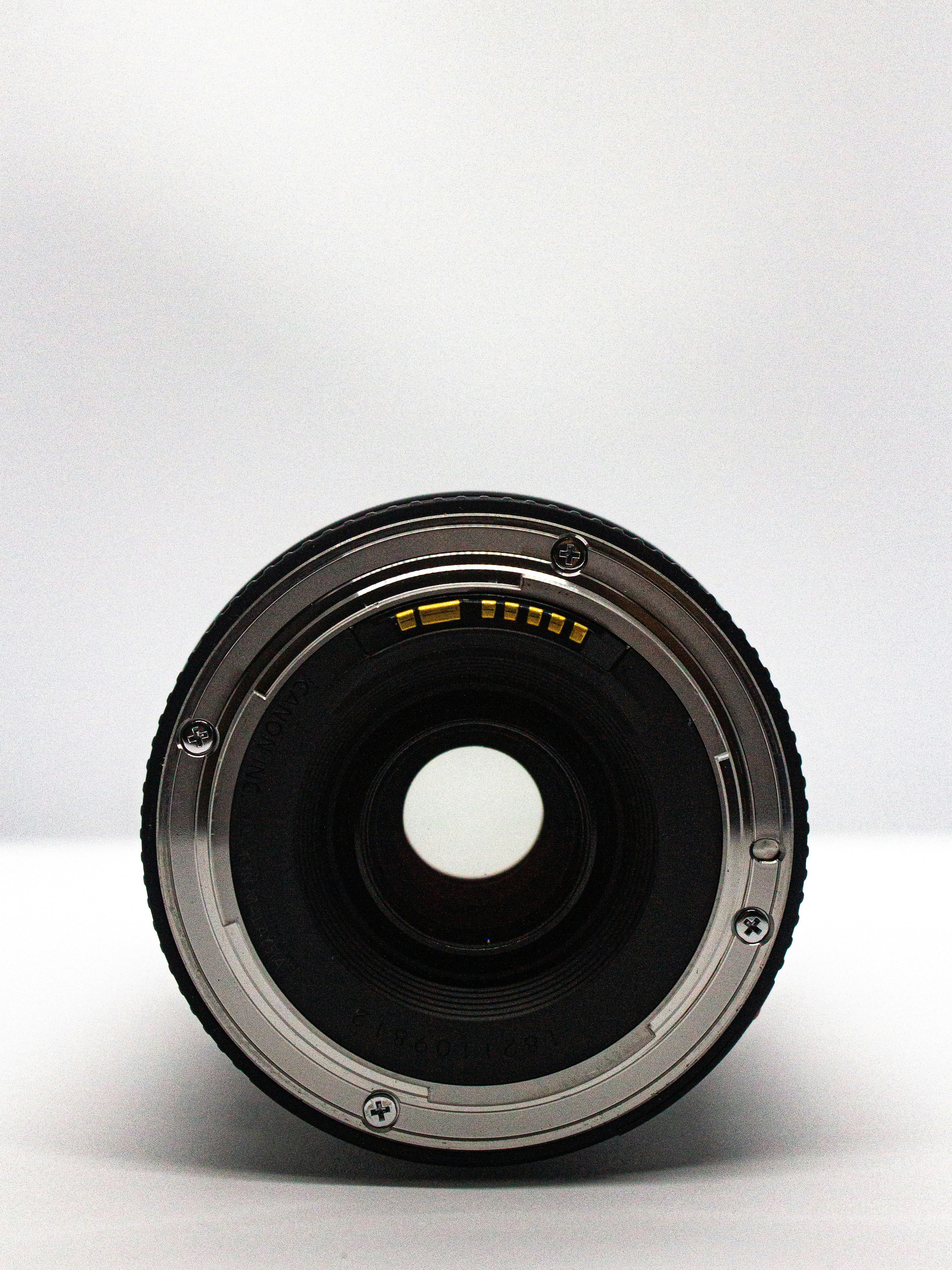 A close up of a camera lens on a white surface photo – Free White ...