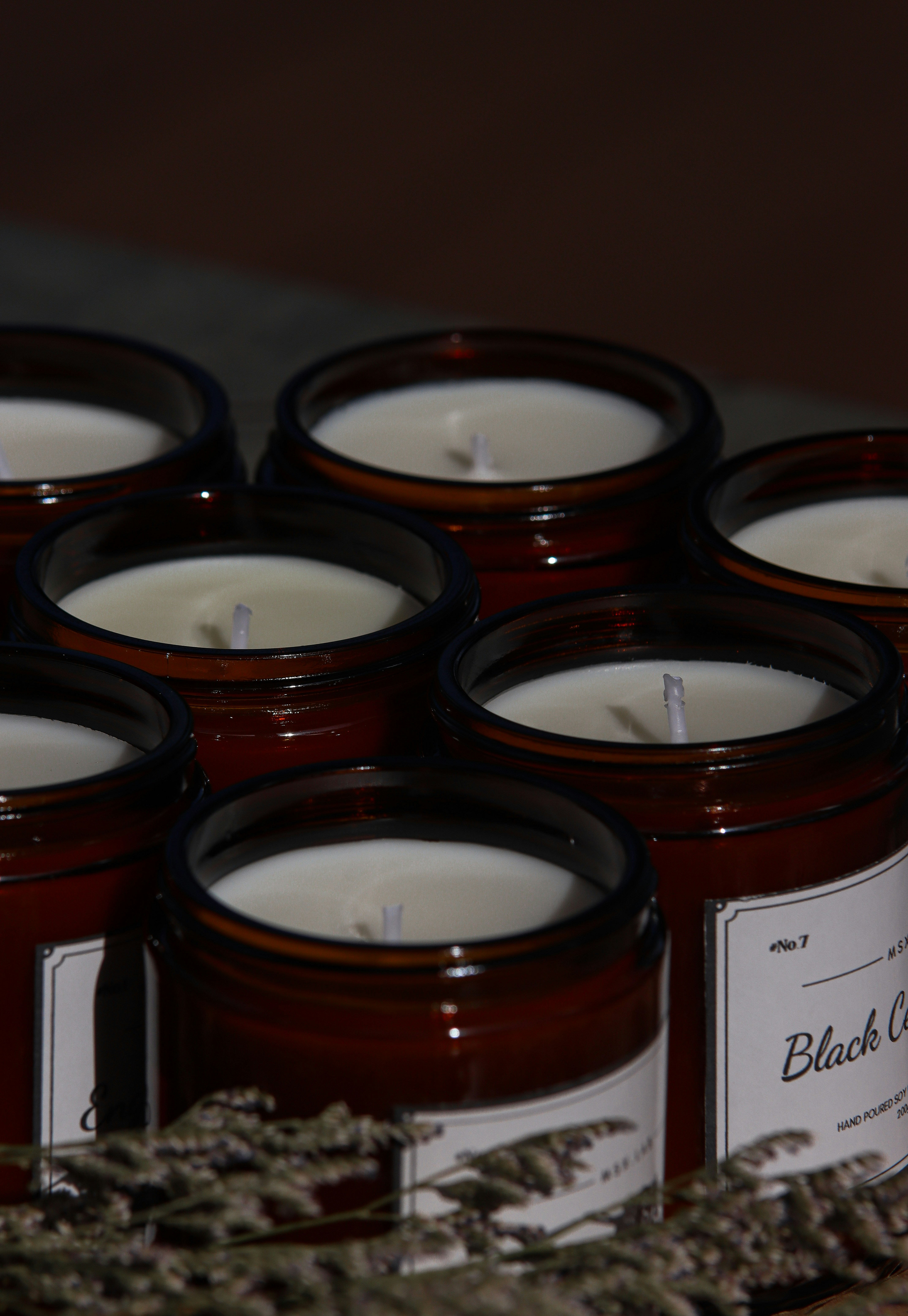 A close up of a bunch of candles on a table photo – Free Candle Image ...