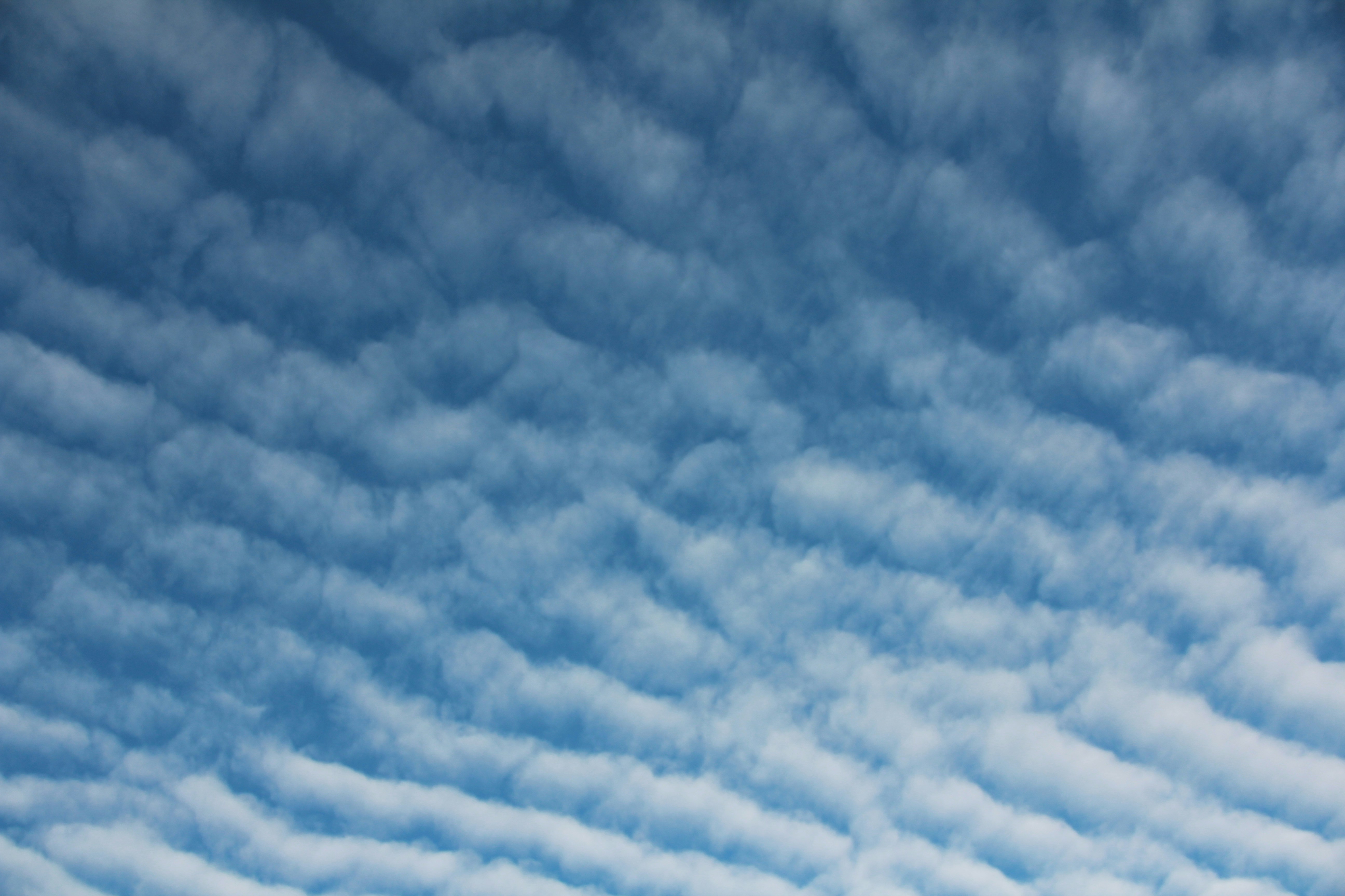 Vast Sky with Layered Clouds Over a Quiet Horizon