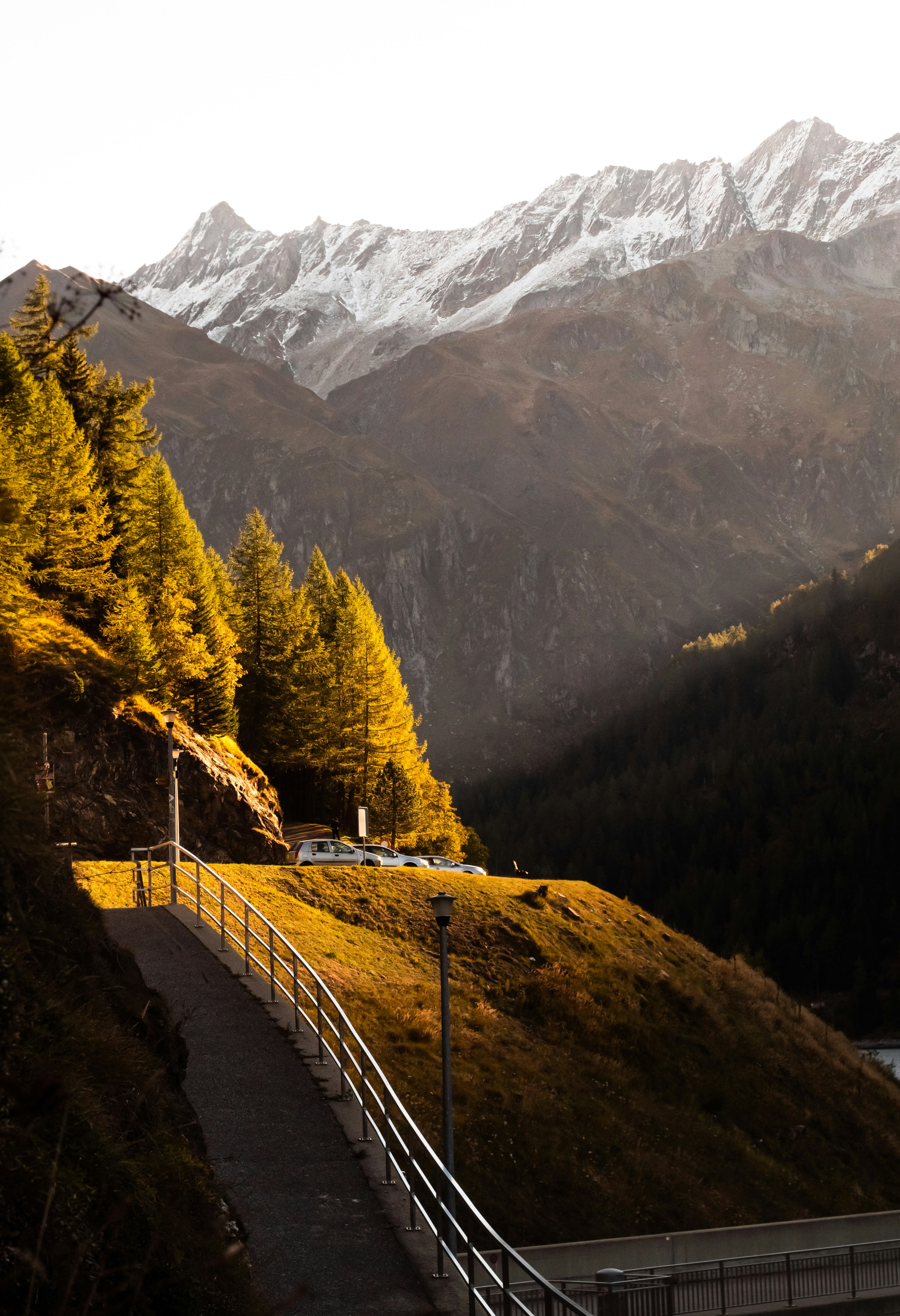 Golden Hour on the Mountain Rail: A Quiet Path Toward Snowy Peaks