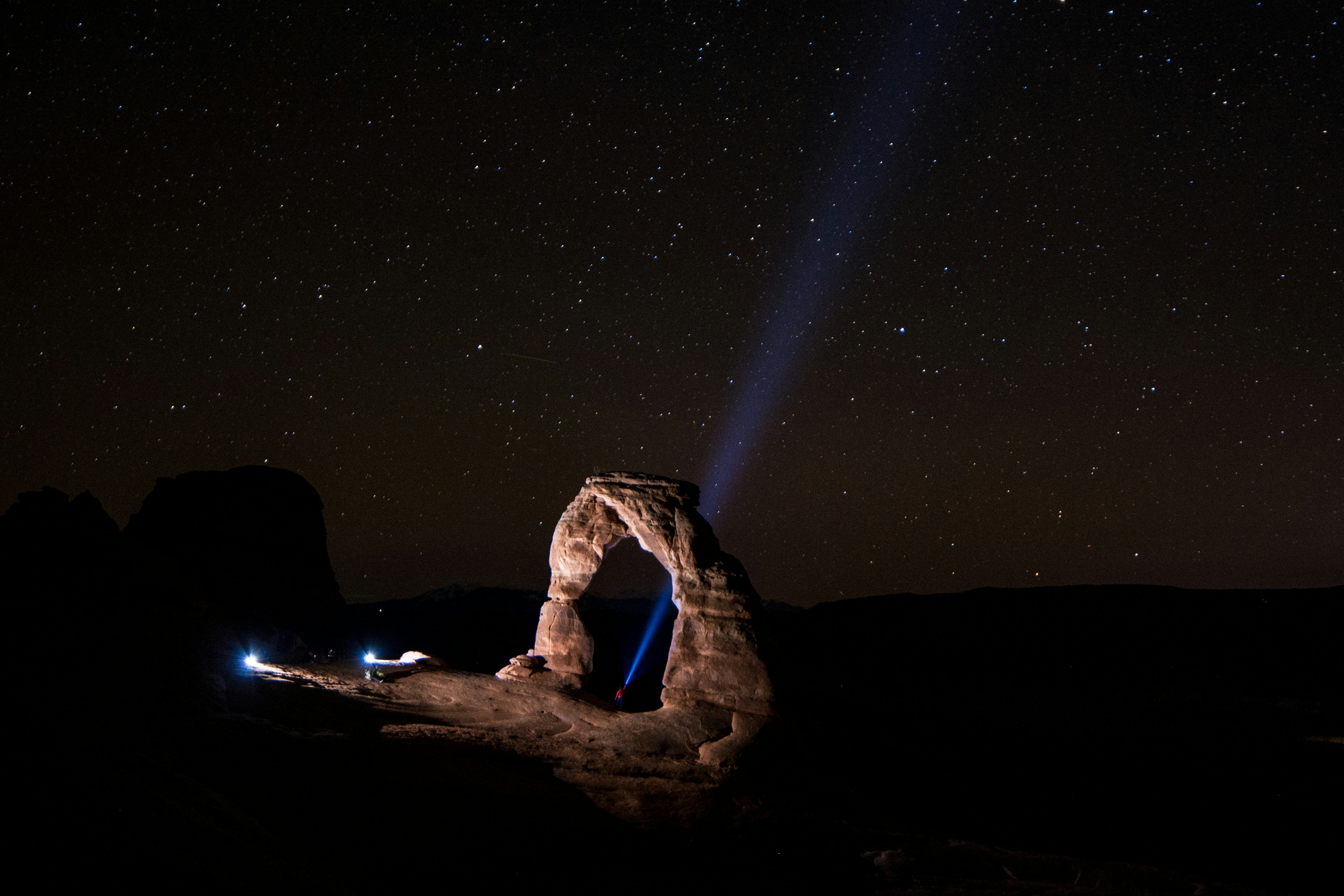 A rock formation with a light beam in the middle of it photo – Free ...