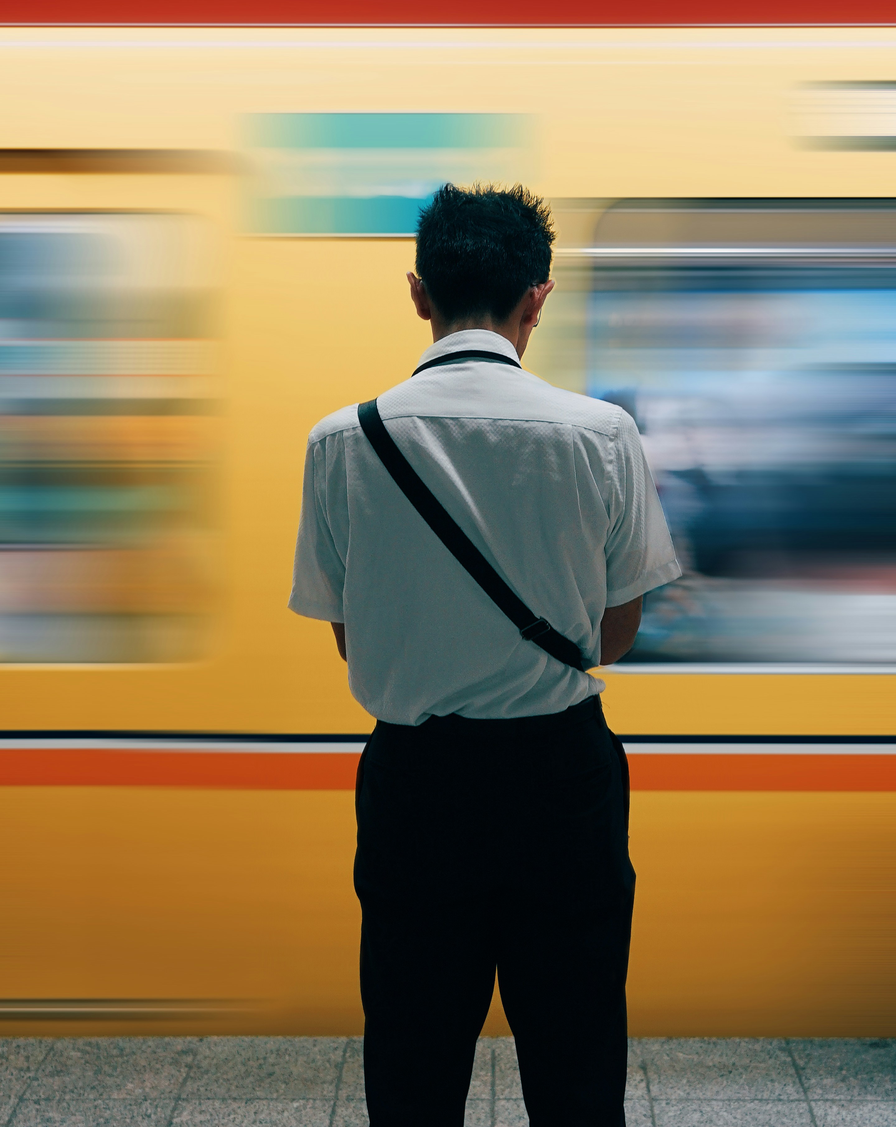 Portrait at the Platform: A Traveler in Motion Blur