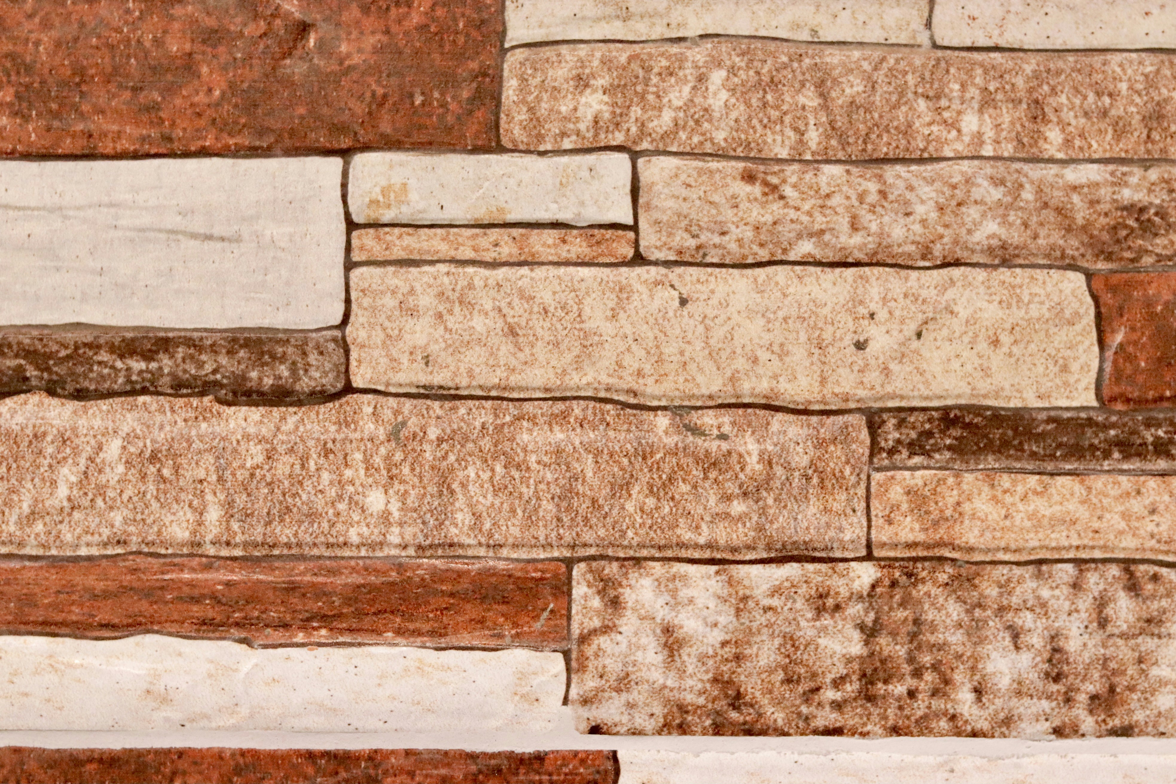Earth-Tone Ledger: A Close-Up of Weathered Brick Layers