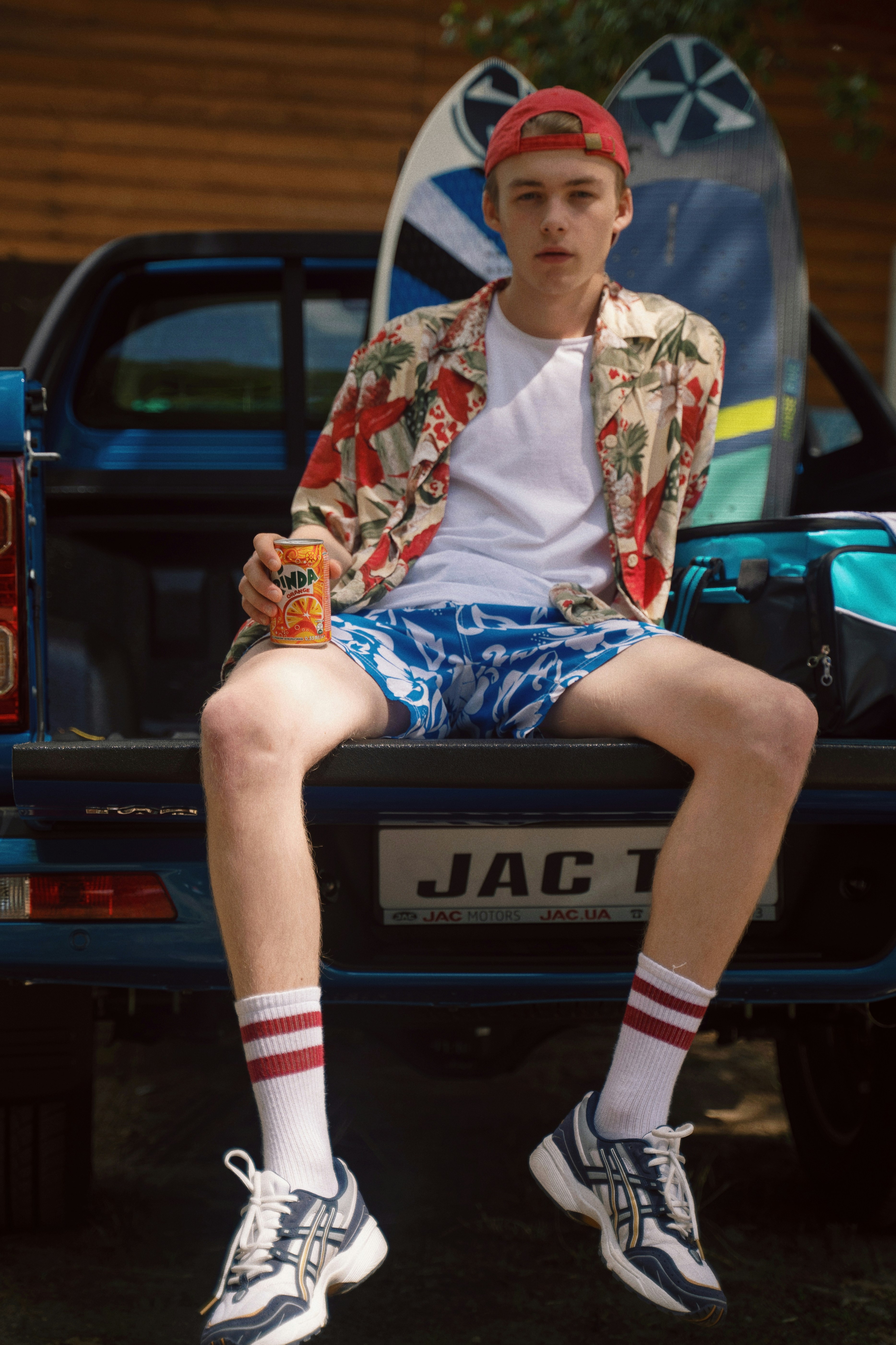 Sunlit Weekend by the Tailgate: Floral Flair with a Surfboard Backdrop