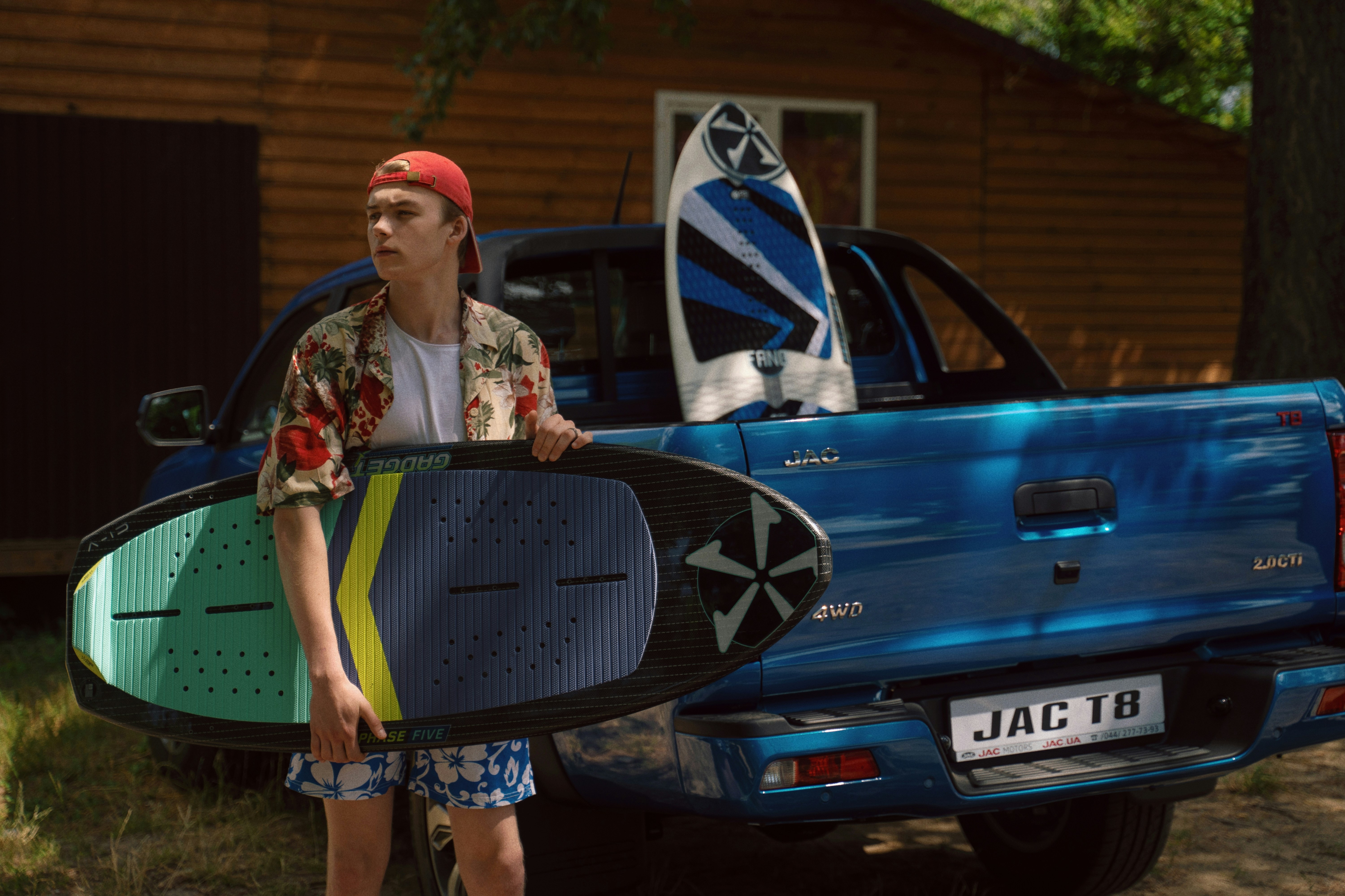 Surfboarder in the Pickup: Quiet Confidence by the Riverbank