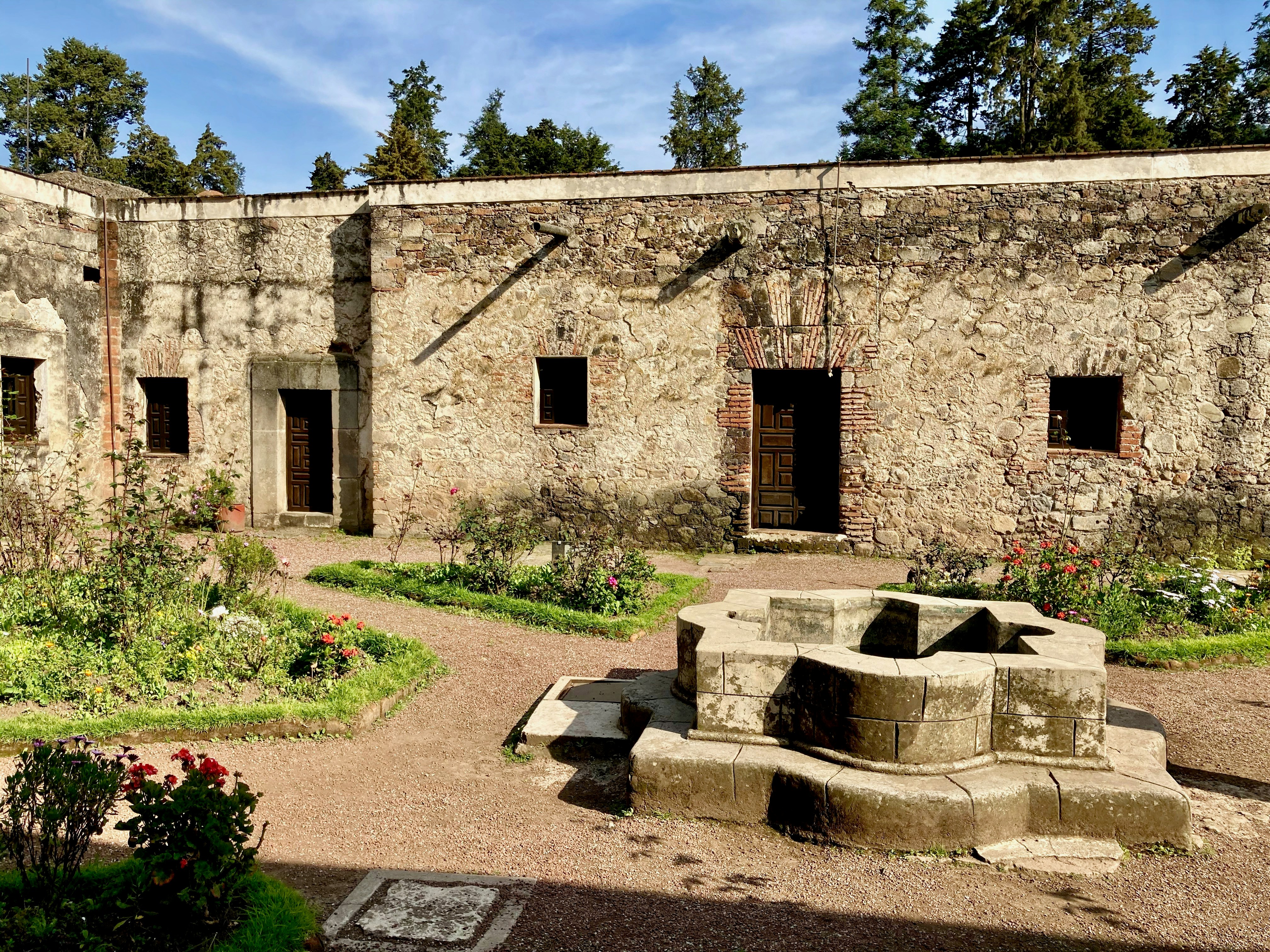 Circular Fountain at the Heart of a Weathered Stone Cloister