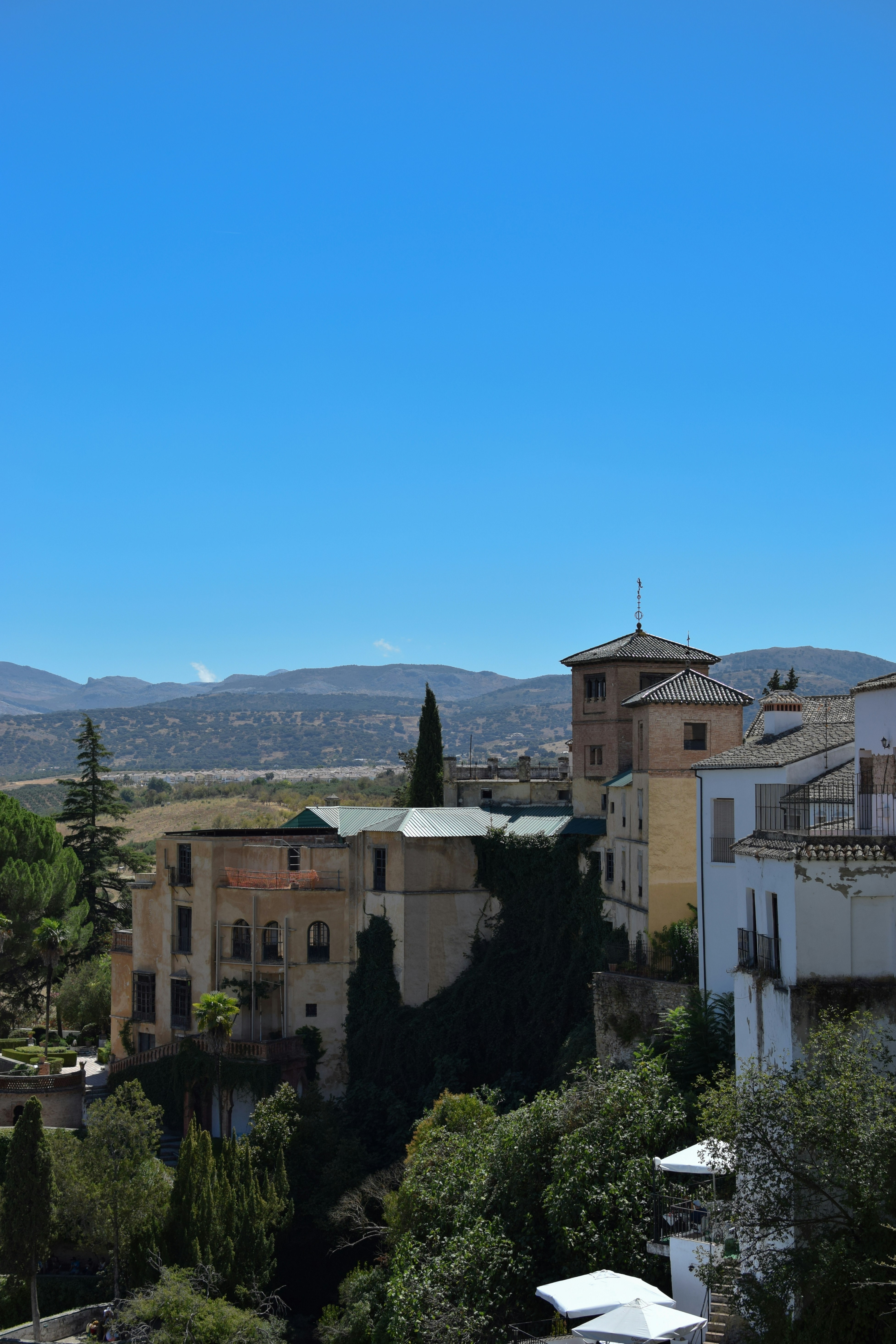 a view of a town with mountains in the background