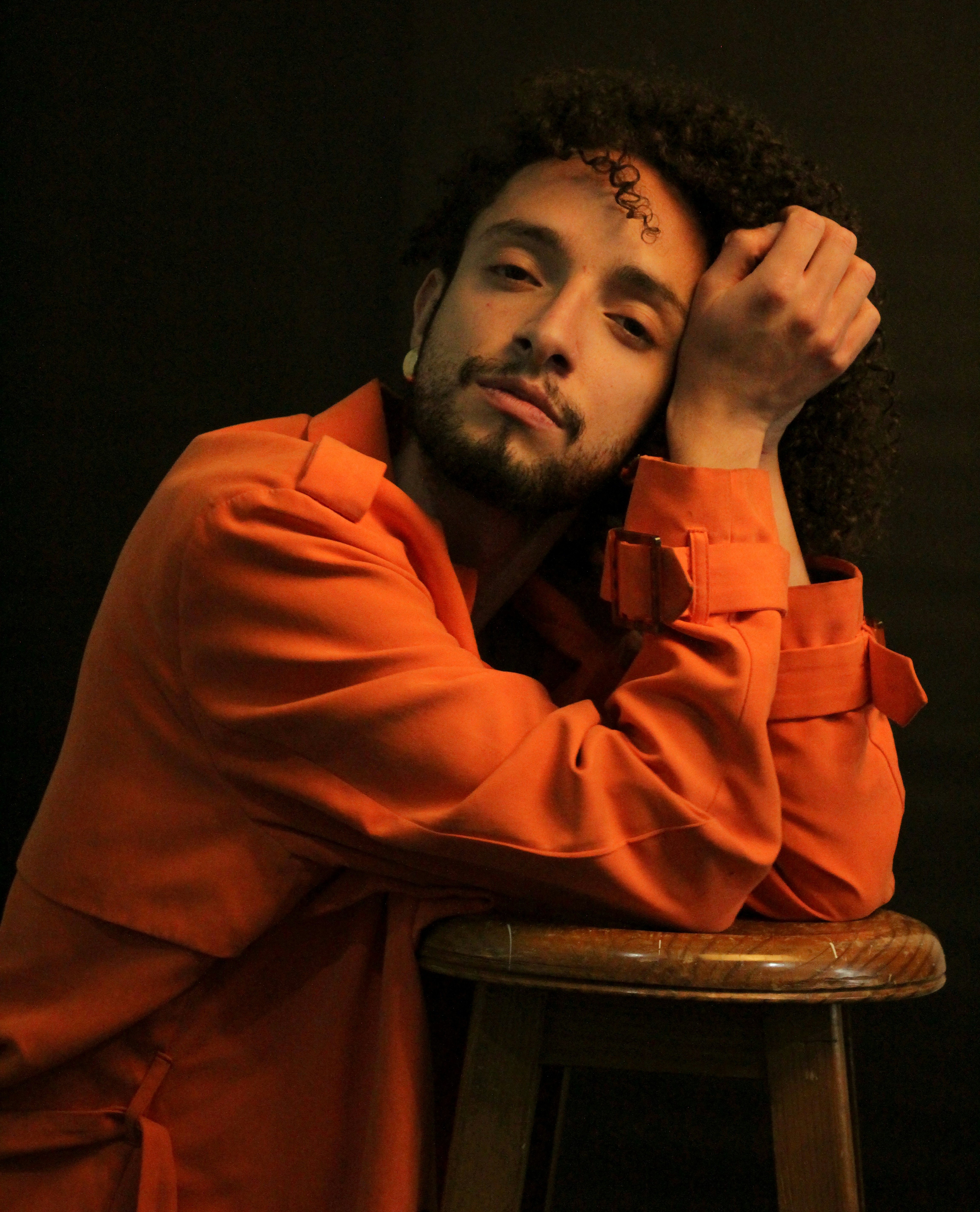 Amber Quiet: A Contemplative Portrait in a Velvet Orange Shirt