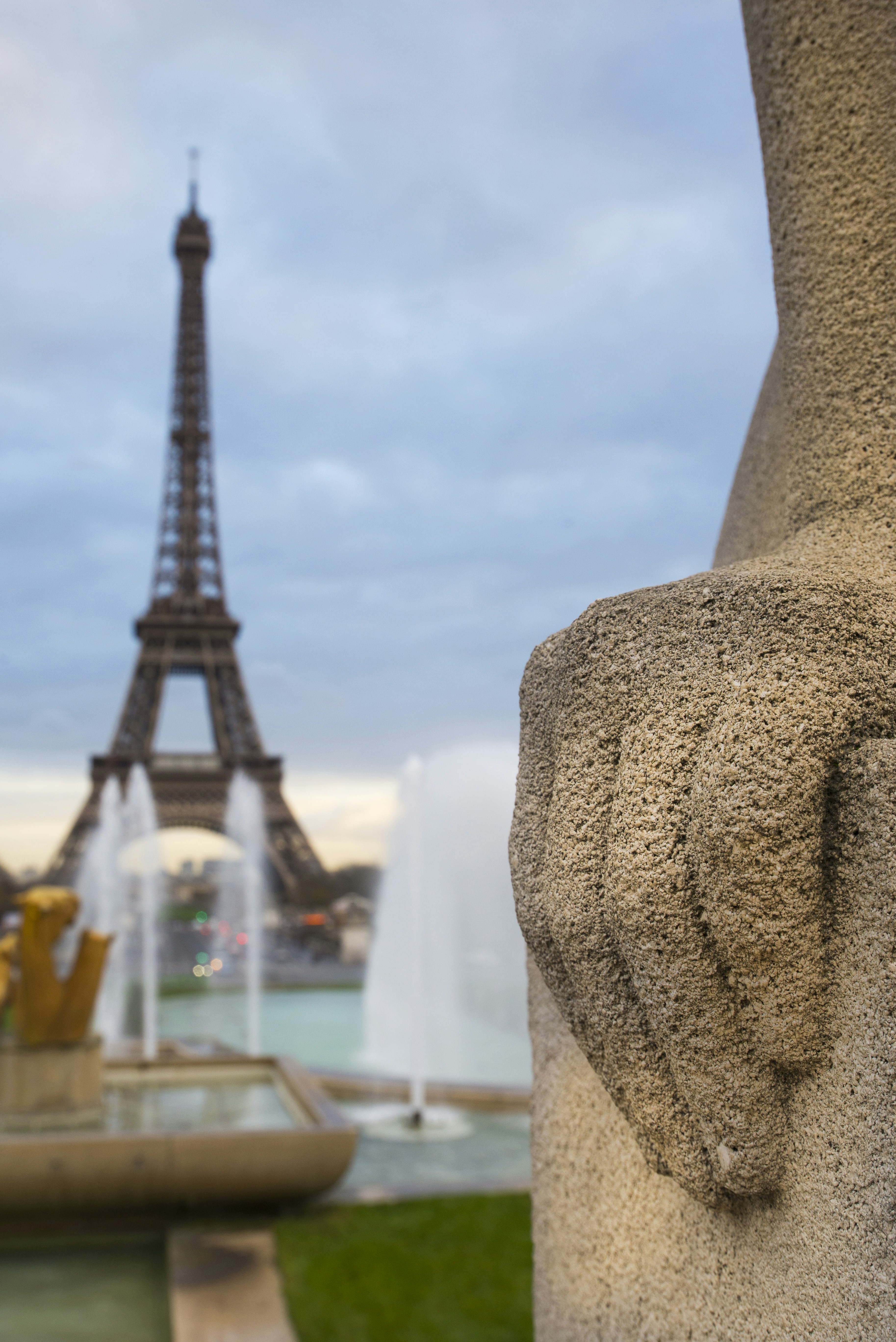 Stone Guardian Framing the Eiffel Tower from the Trocadéro Gardens