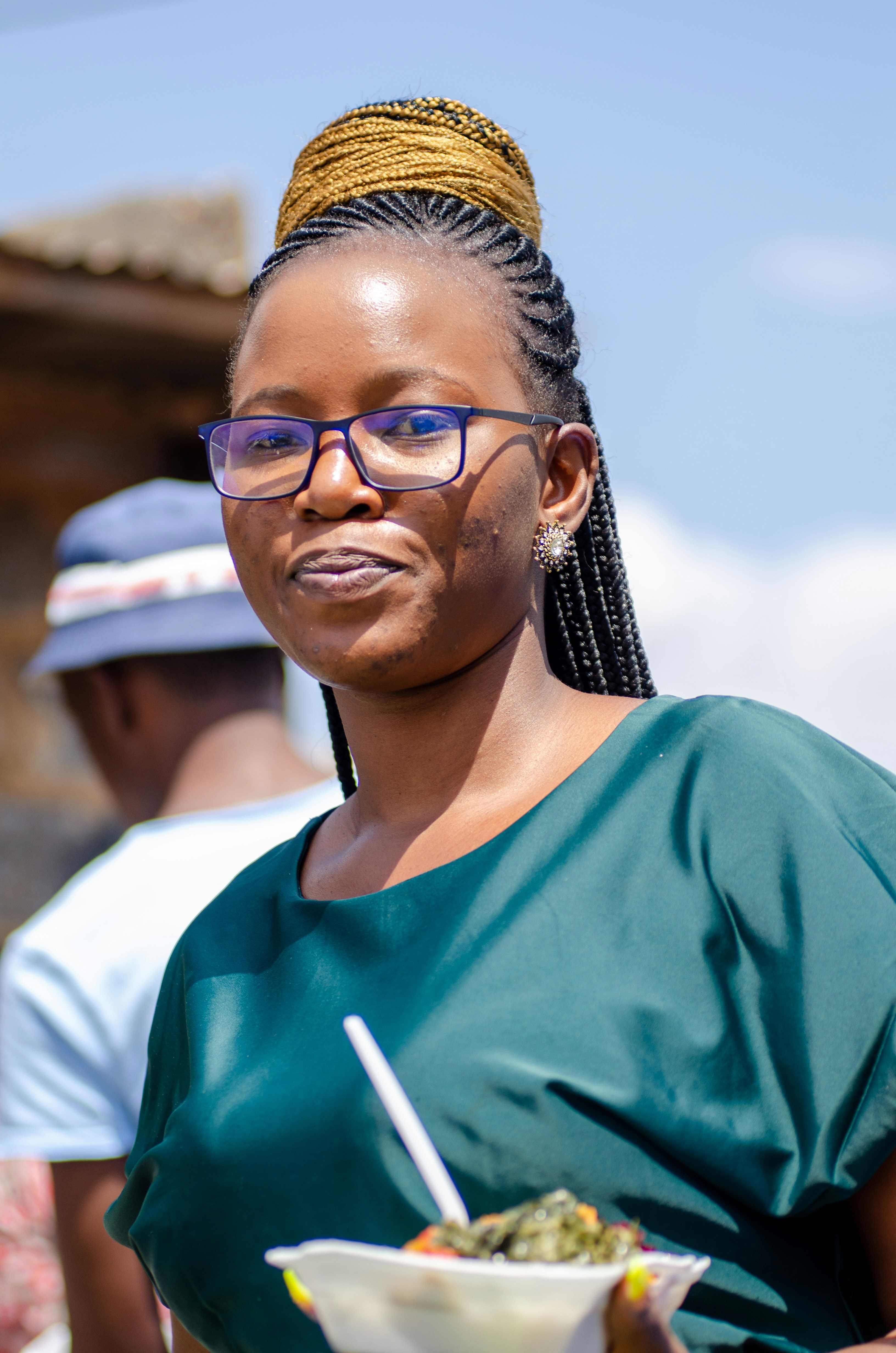 Confident Smile Under Glasses: A Portrait in Solar Light