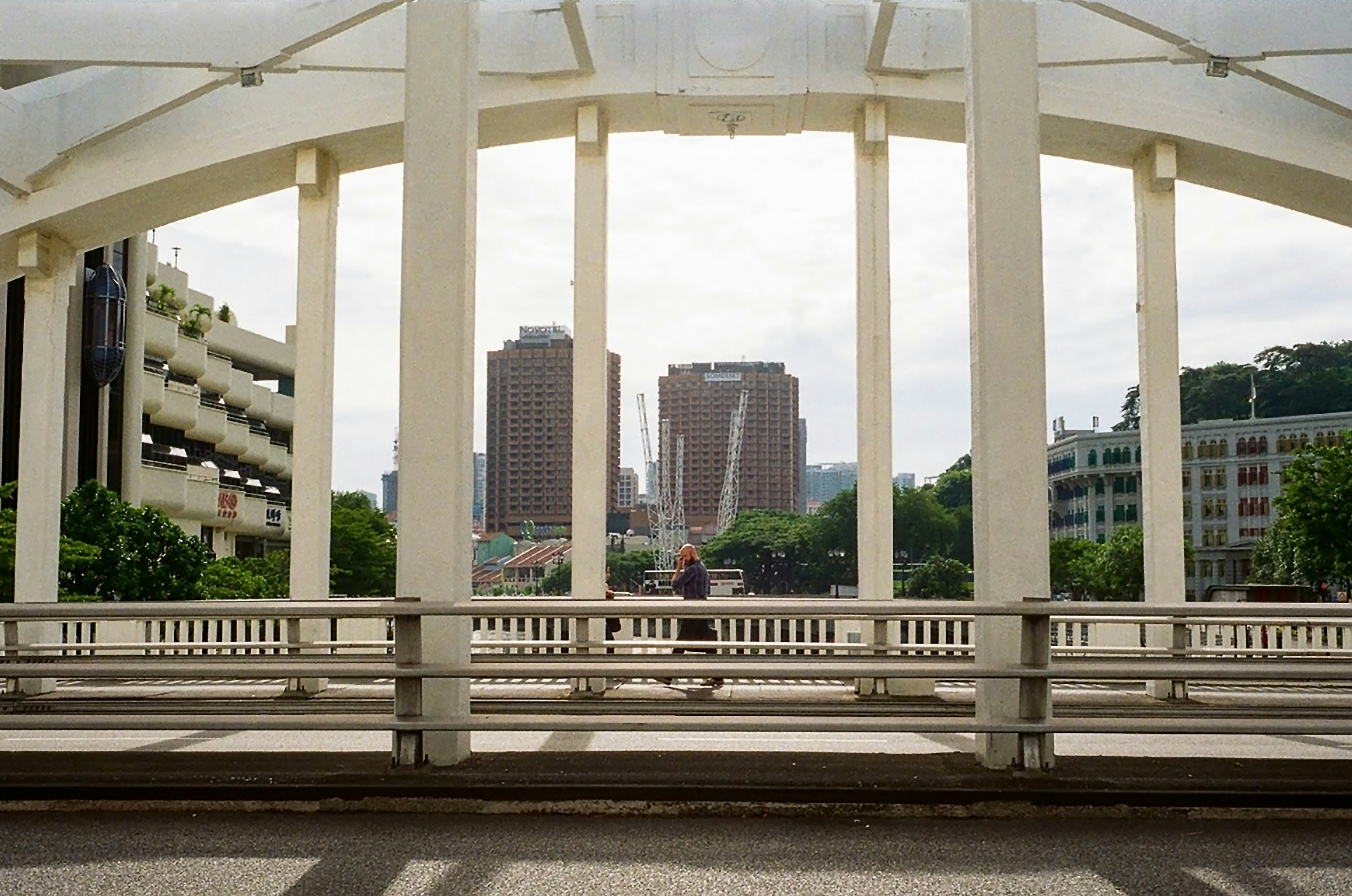 A bridge with a view of a city in the distance photo – Free Building ...