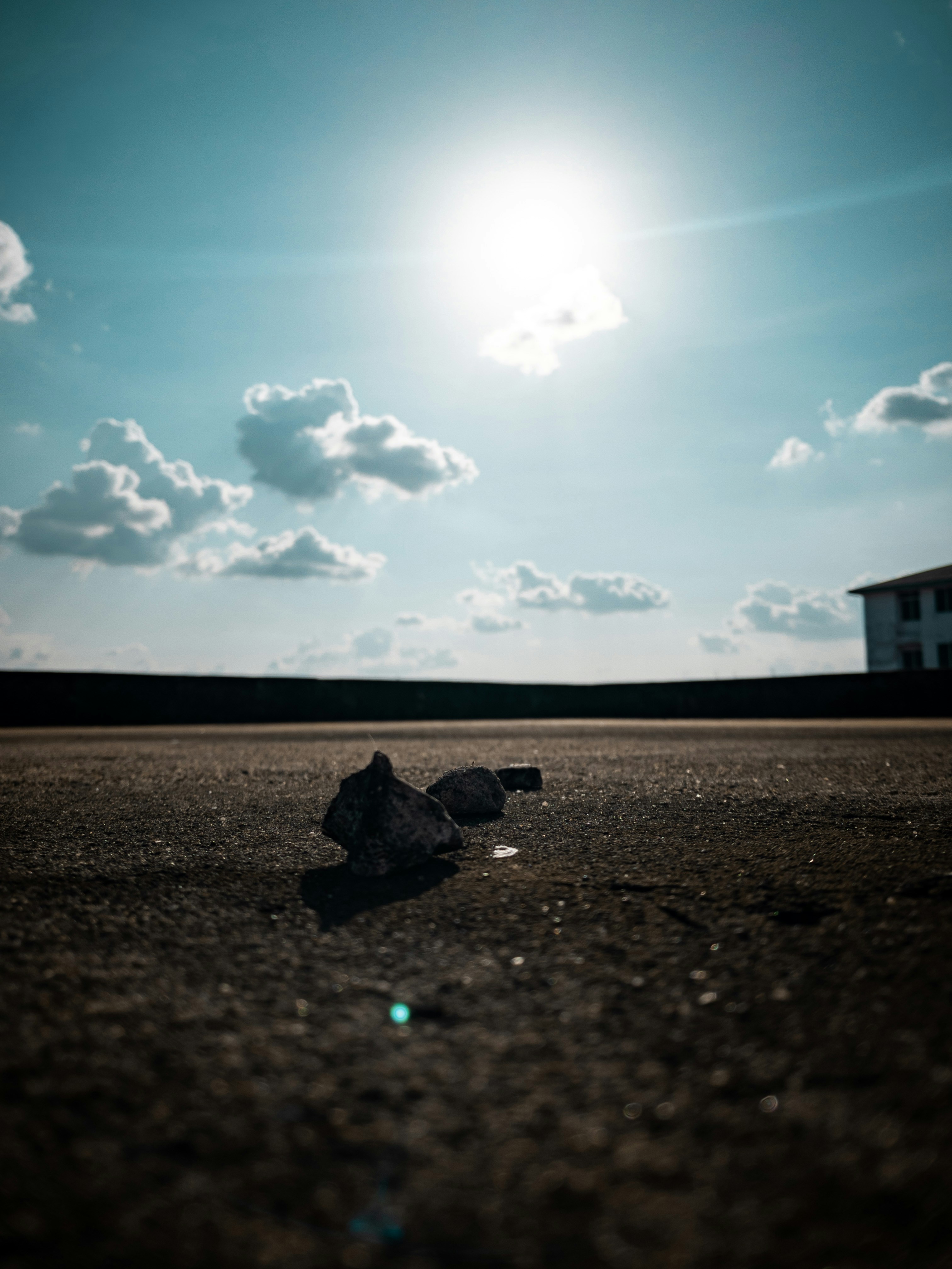 a broken fire hydrant sitting in the middle of a field