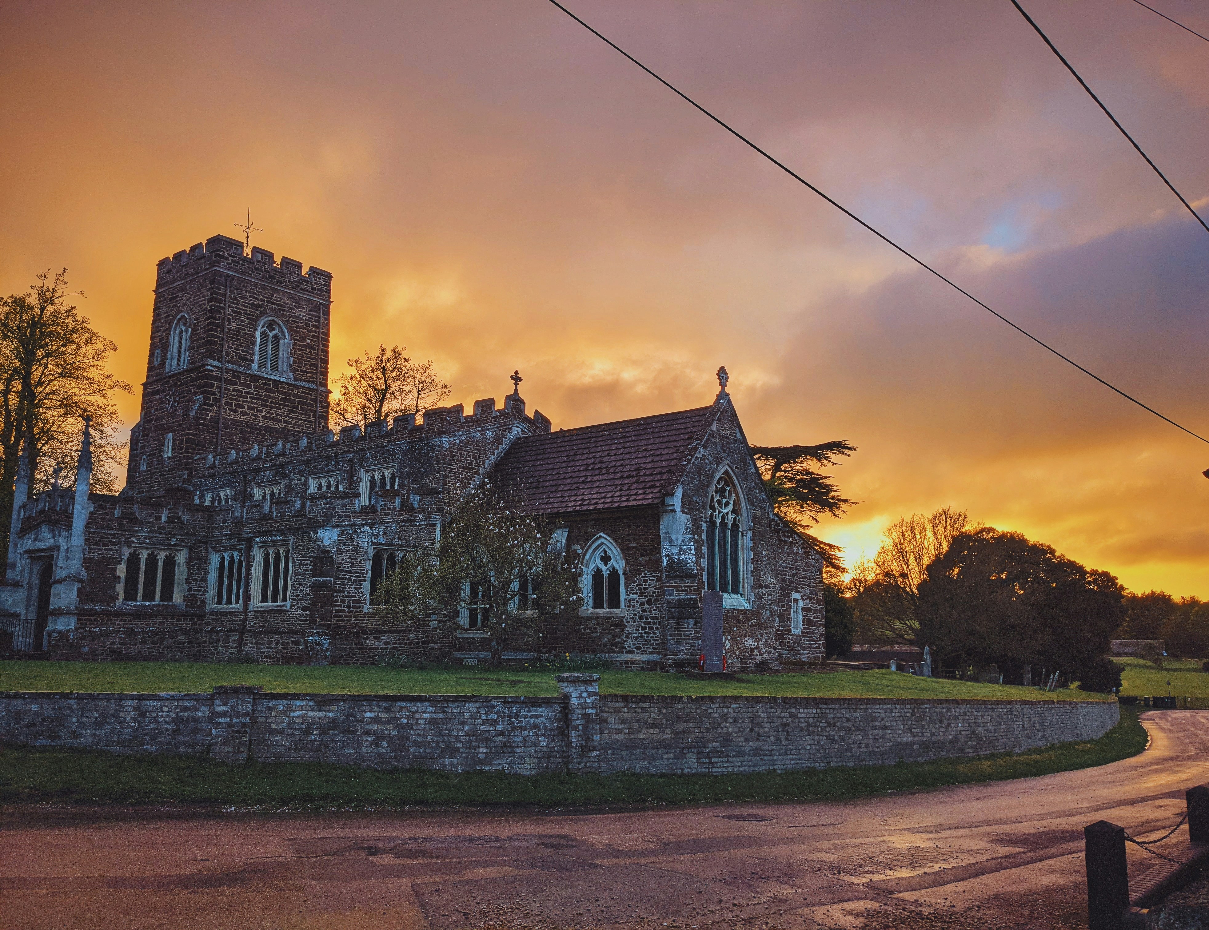 Amber Hour over the Ashlar Church: Towered Silhouette at Dusk