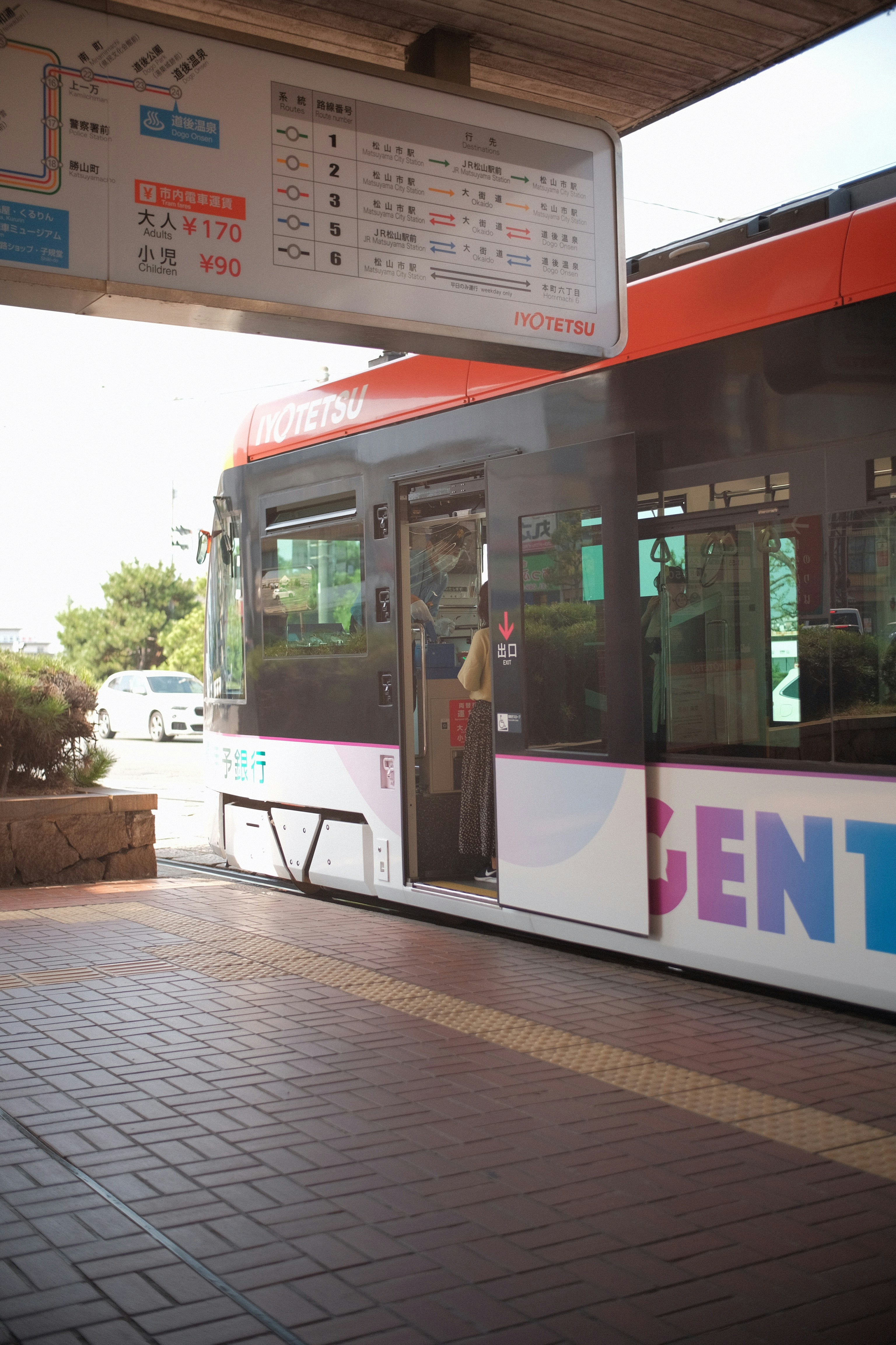 A public transit bus stopped at a bus stop photo – Free Transportation ...