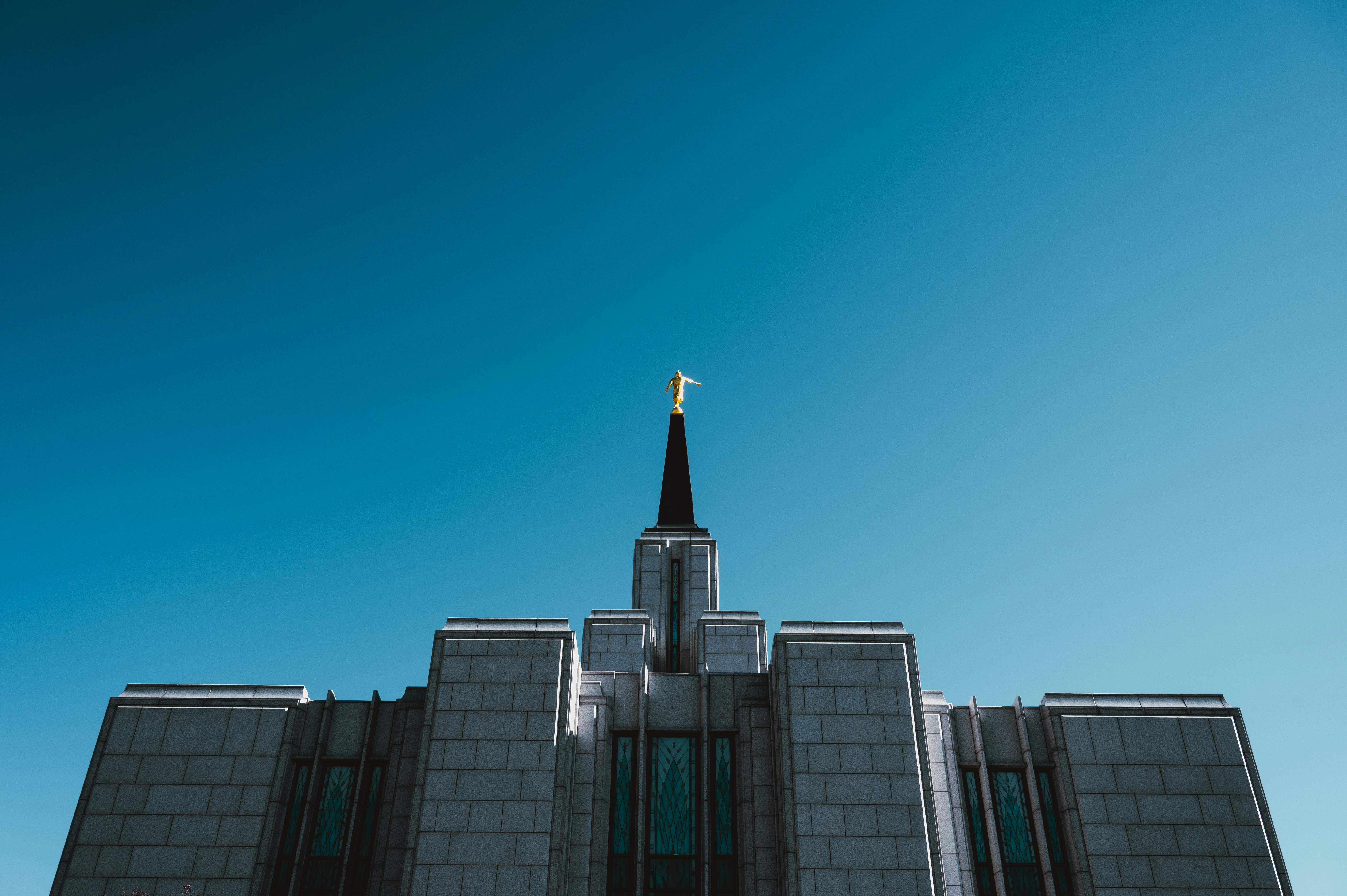 Spire Crowned Above Geometry: A Quiet Monument Reaches Skyward