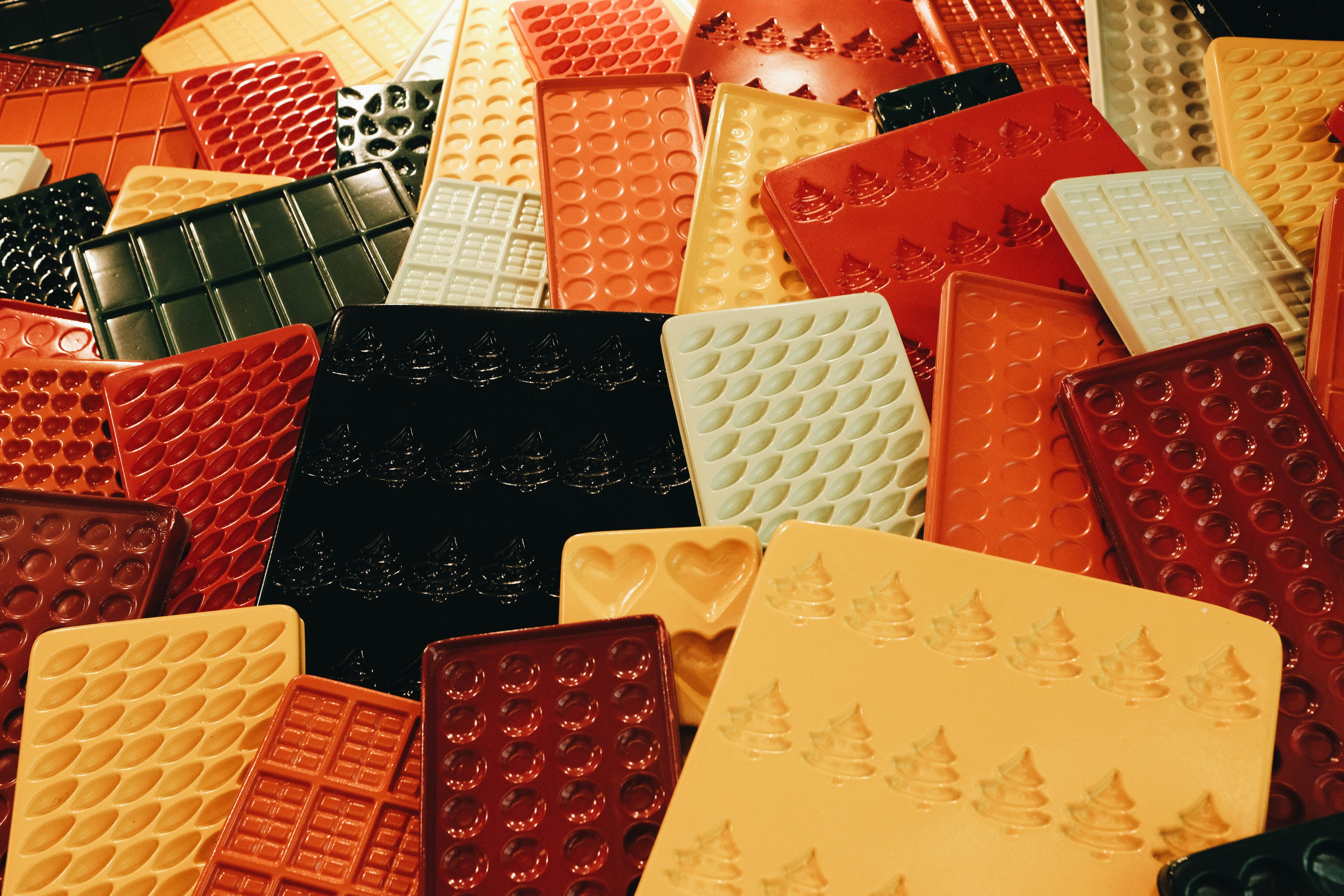 An array of colorful silicone molds in various shapes and sizes, showcasing the versatility of baking tools.