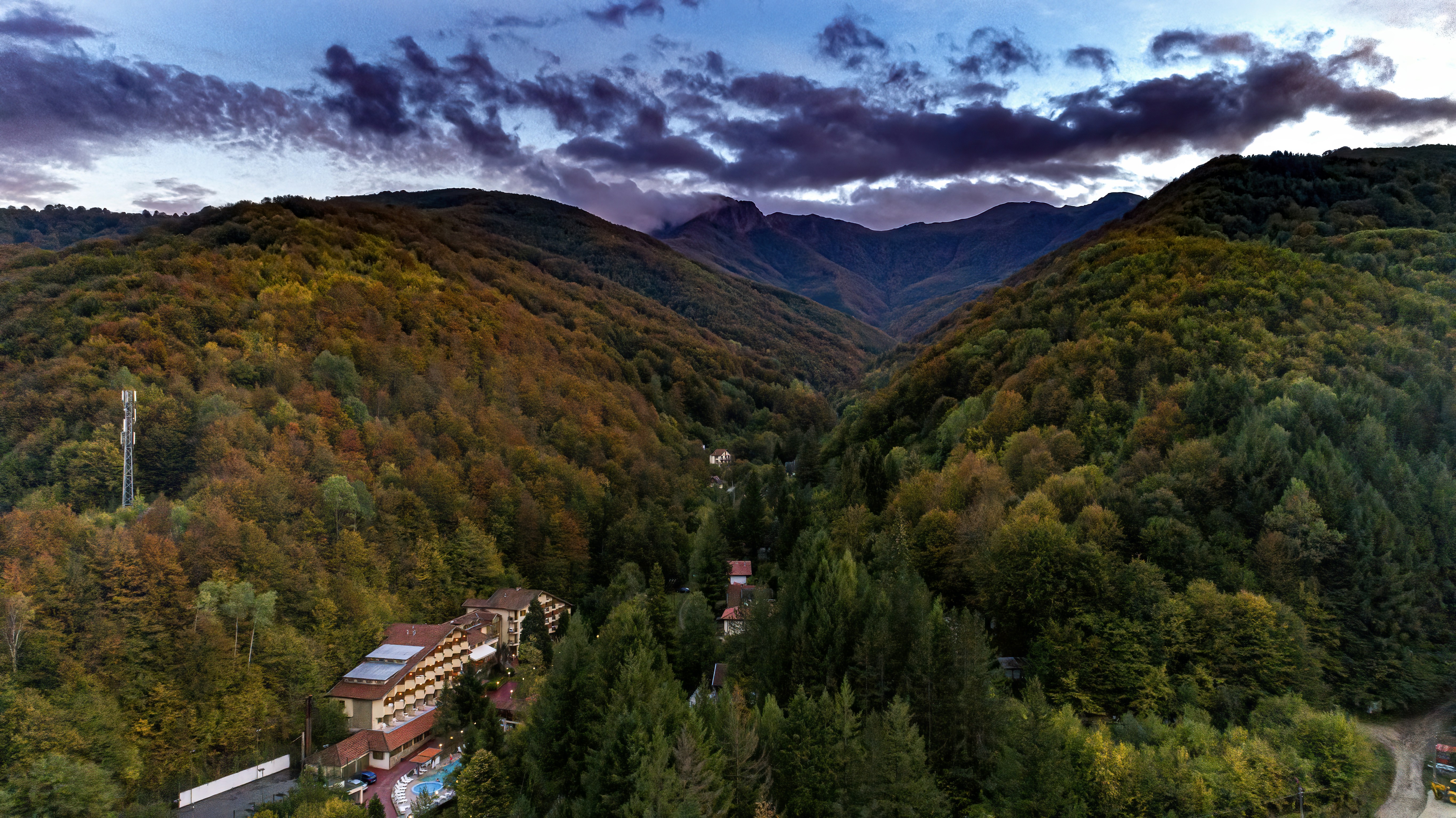 Autumn Vale: A Drone View Over a Village Nestled in Golden Hills