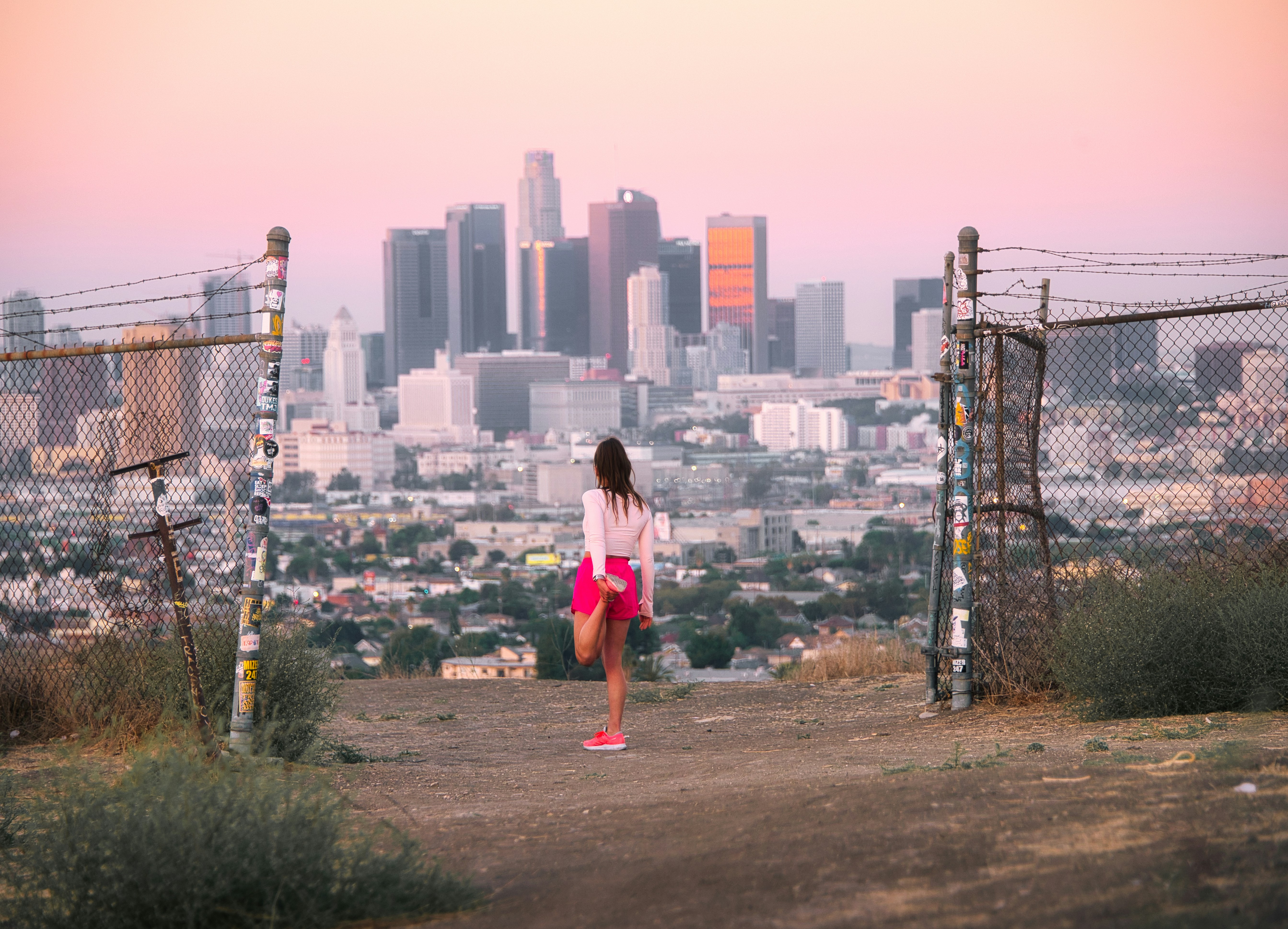 Horizon Gate: A lone jogger with the city in bloom