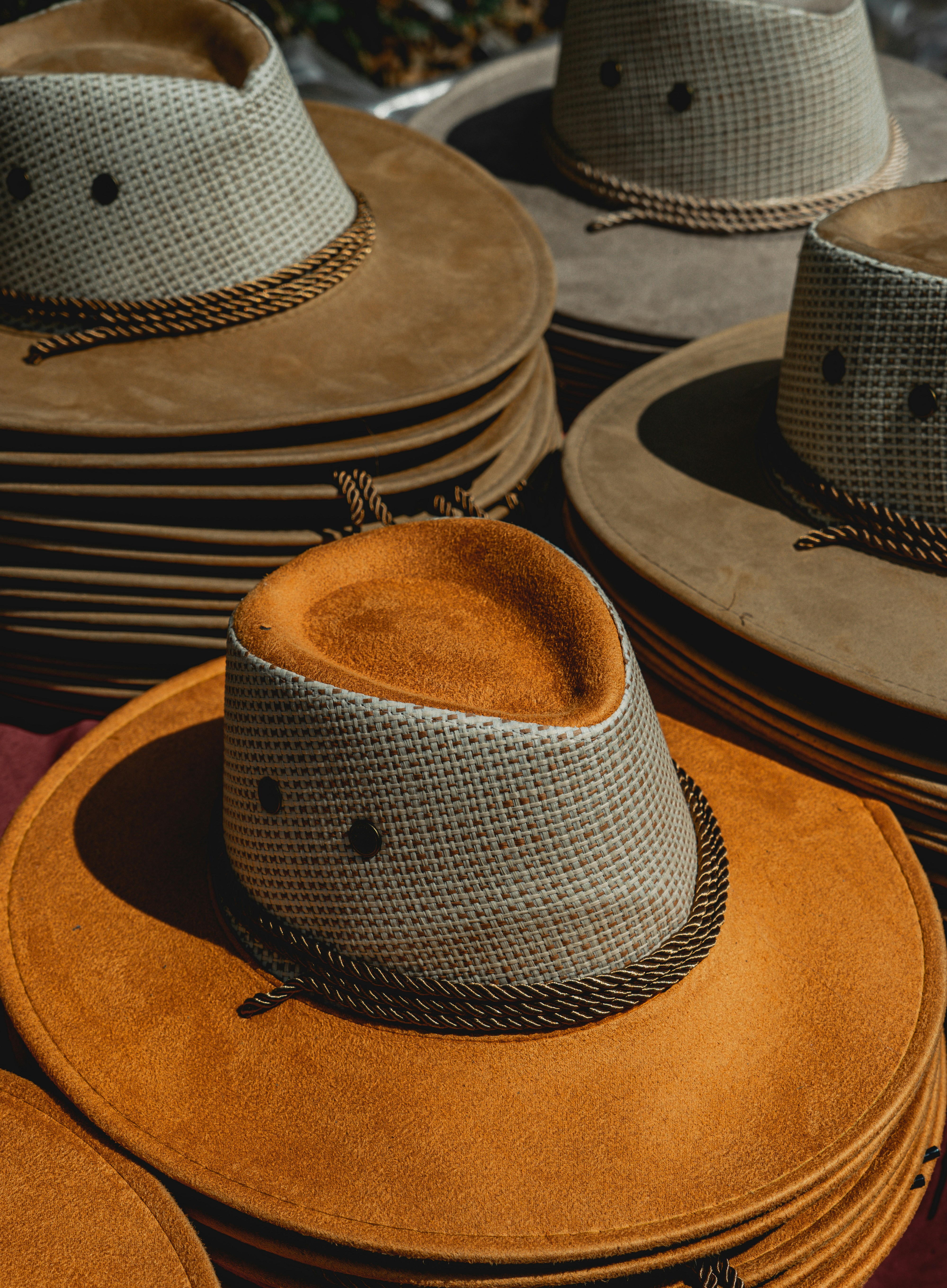 A pile of hats sitting on top of each other photo – Free Clothing Image ...