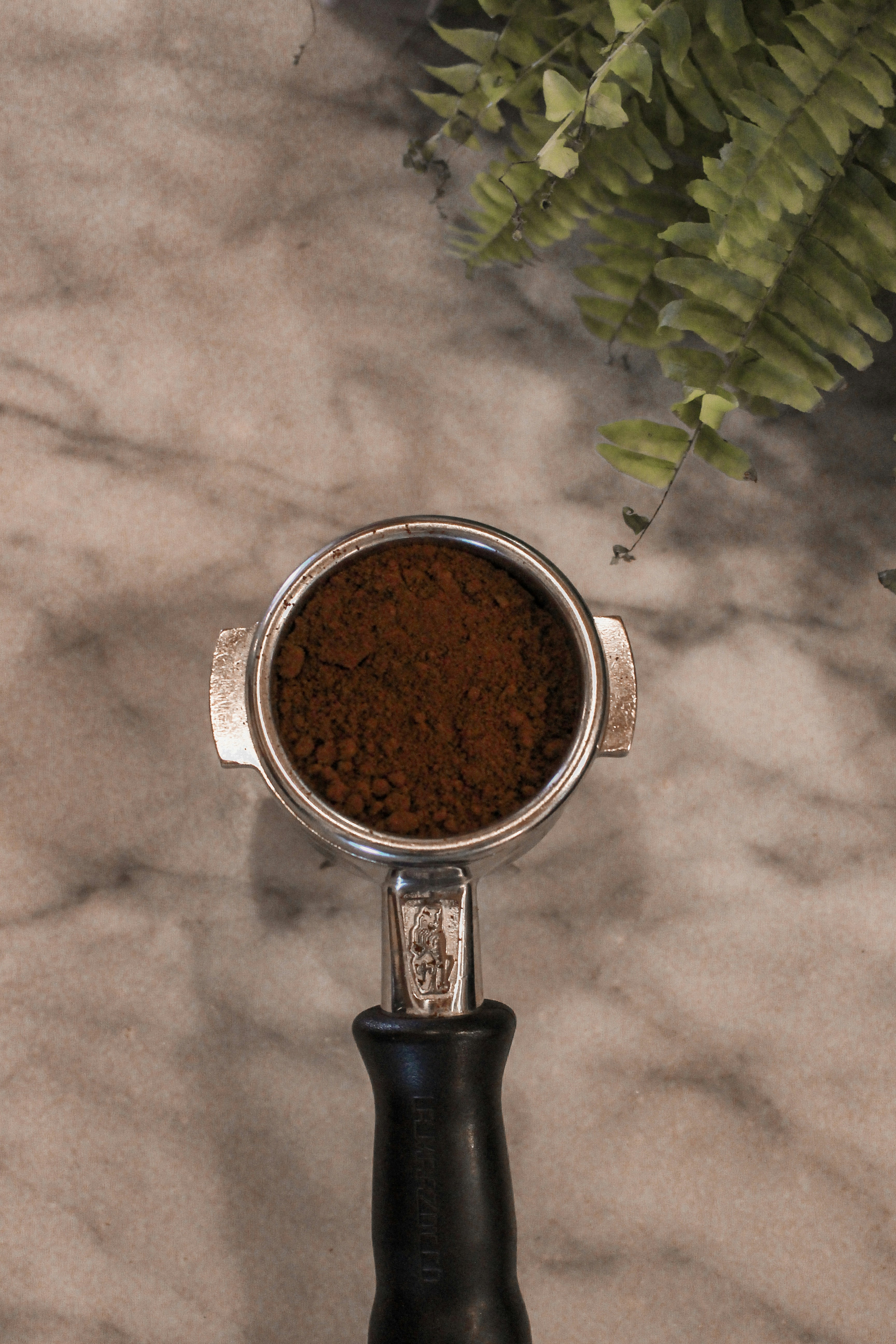 a cup of coffee sitting on top of a table